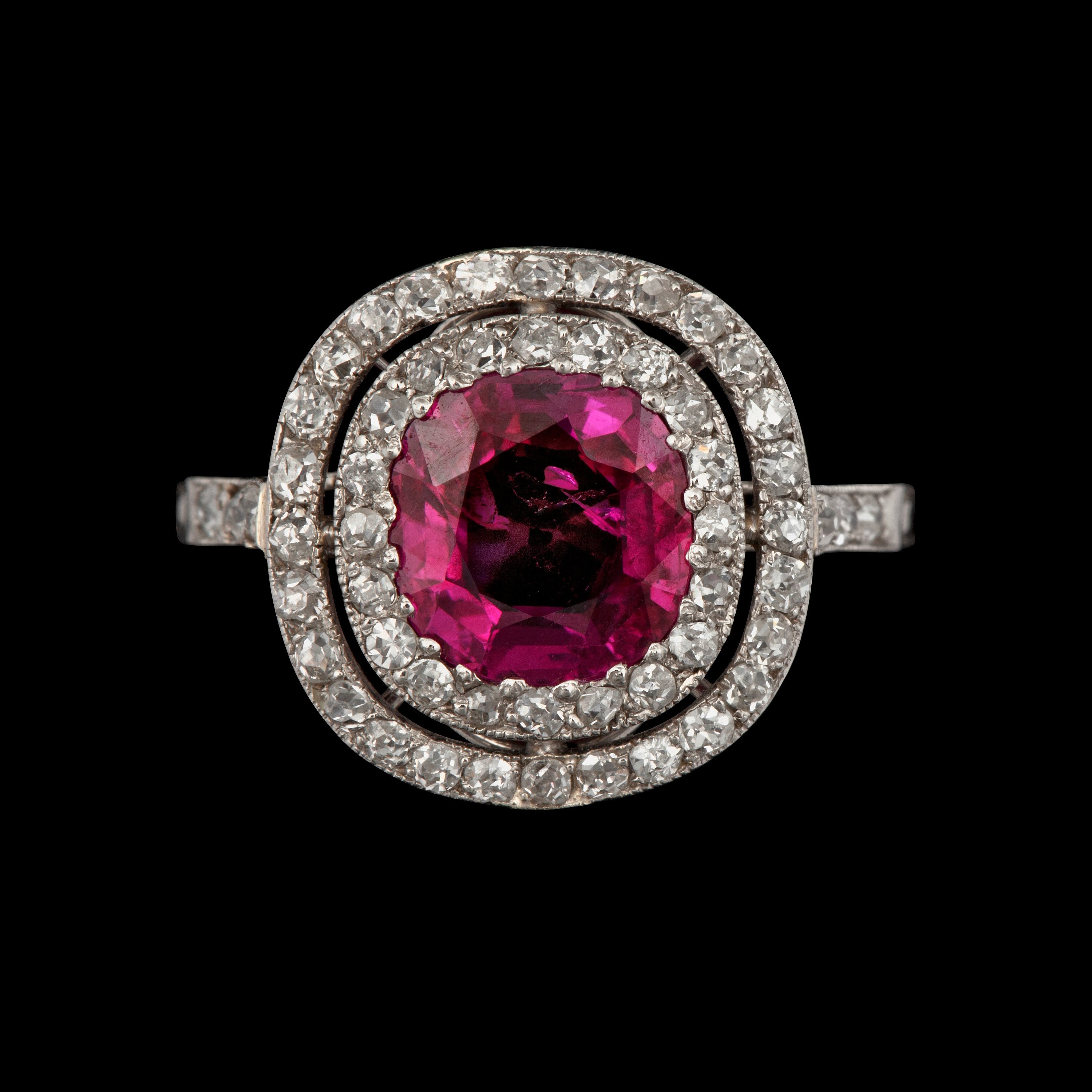 A 2.05 ct untreated Burmese ruby surrounded by old-cut diamonds, total ...
