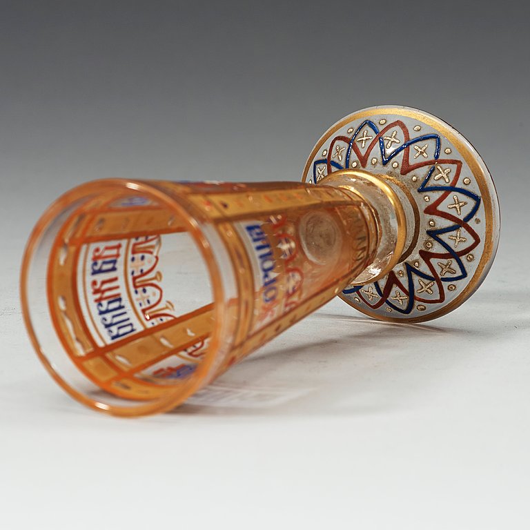 A small Russian vodka glass painted with enamel colours and gold, late ...