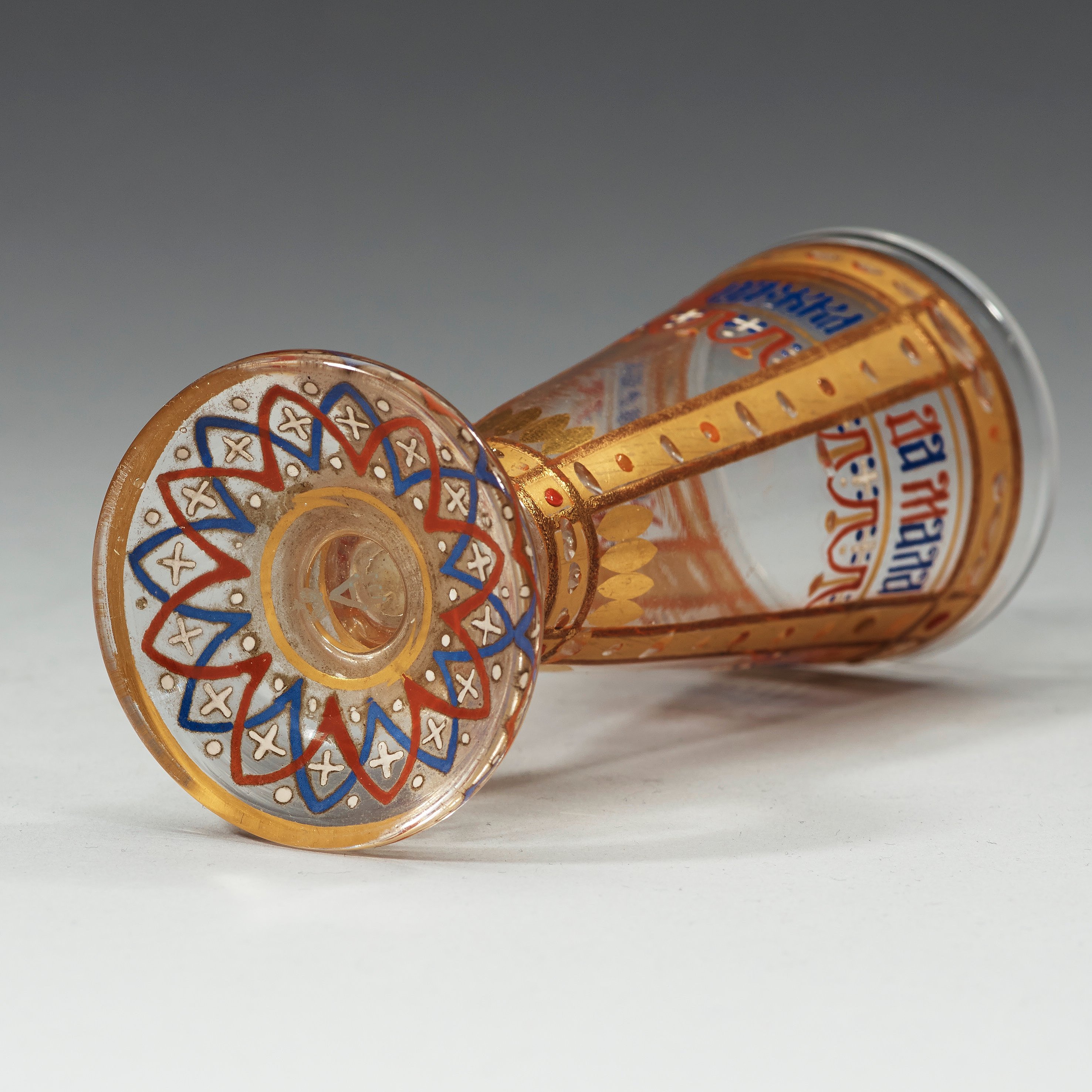 A small Russian vodka glass painted with enamel colours and gold, late ...