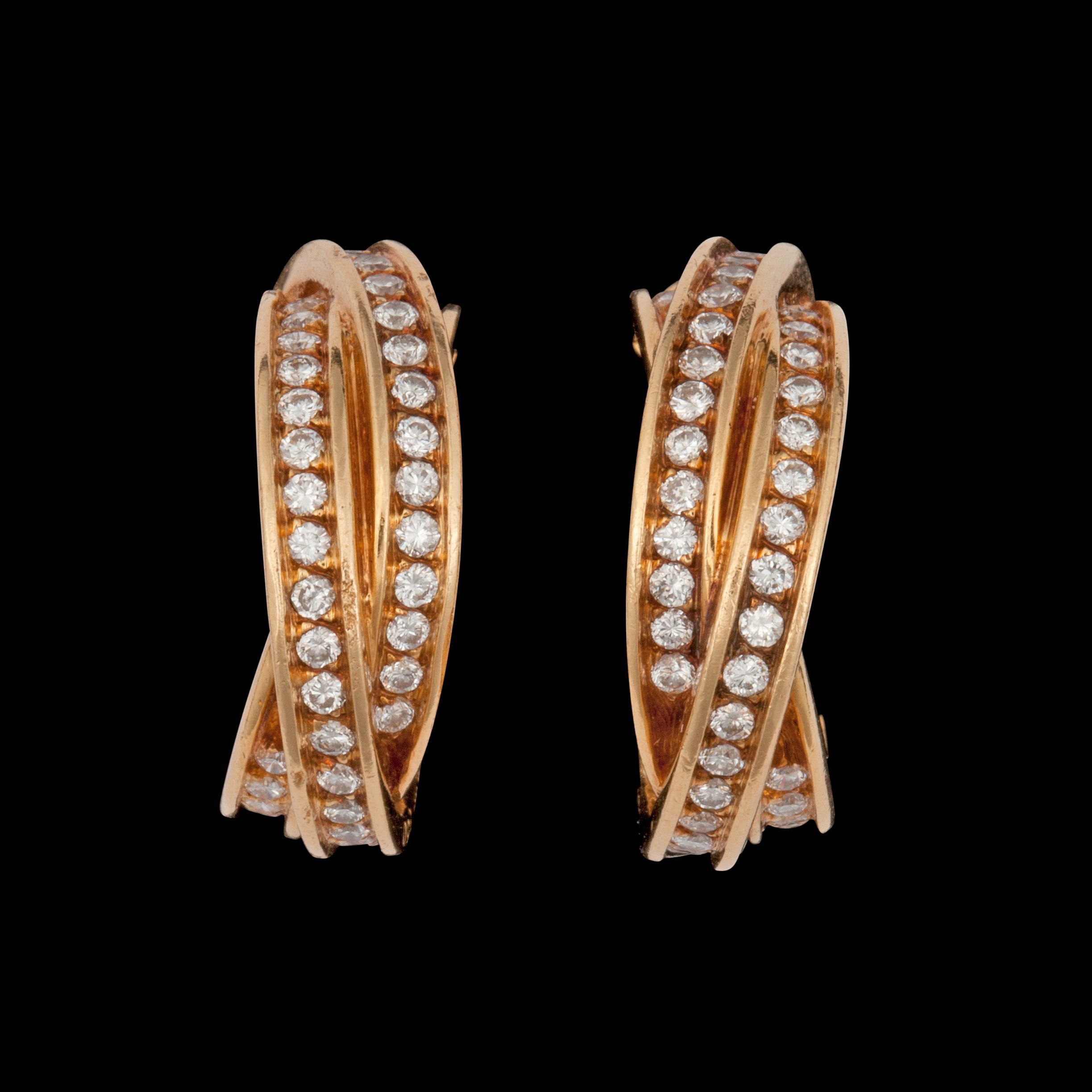 A pair of Cartier diamond earrings. Total carat weight circa 1.25 cts ...