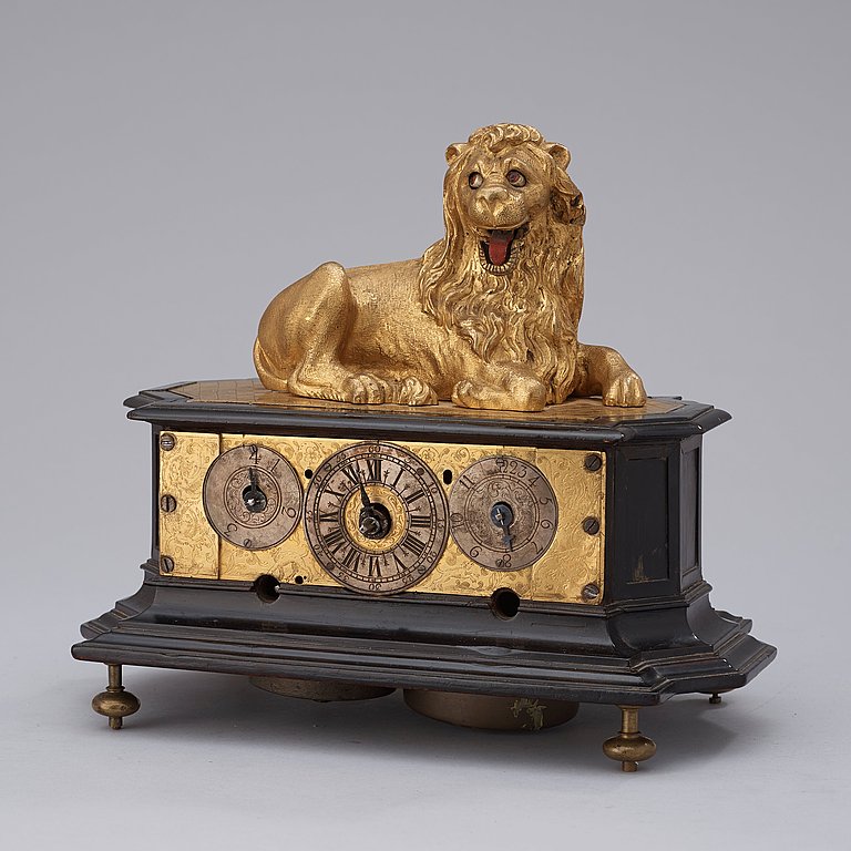 A rare gilt brass on ebonised base Lion Automaton figure clock ...