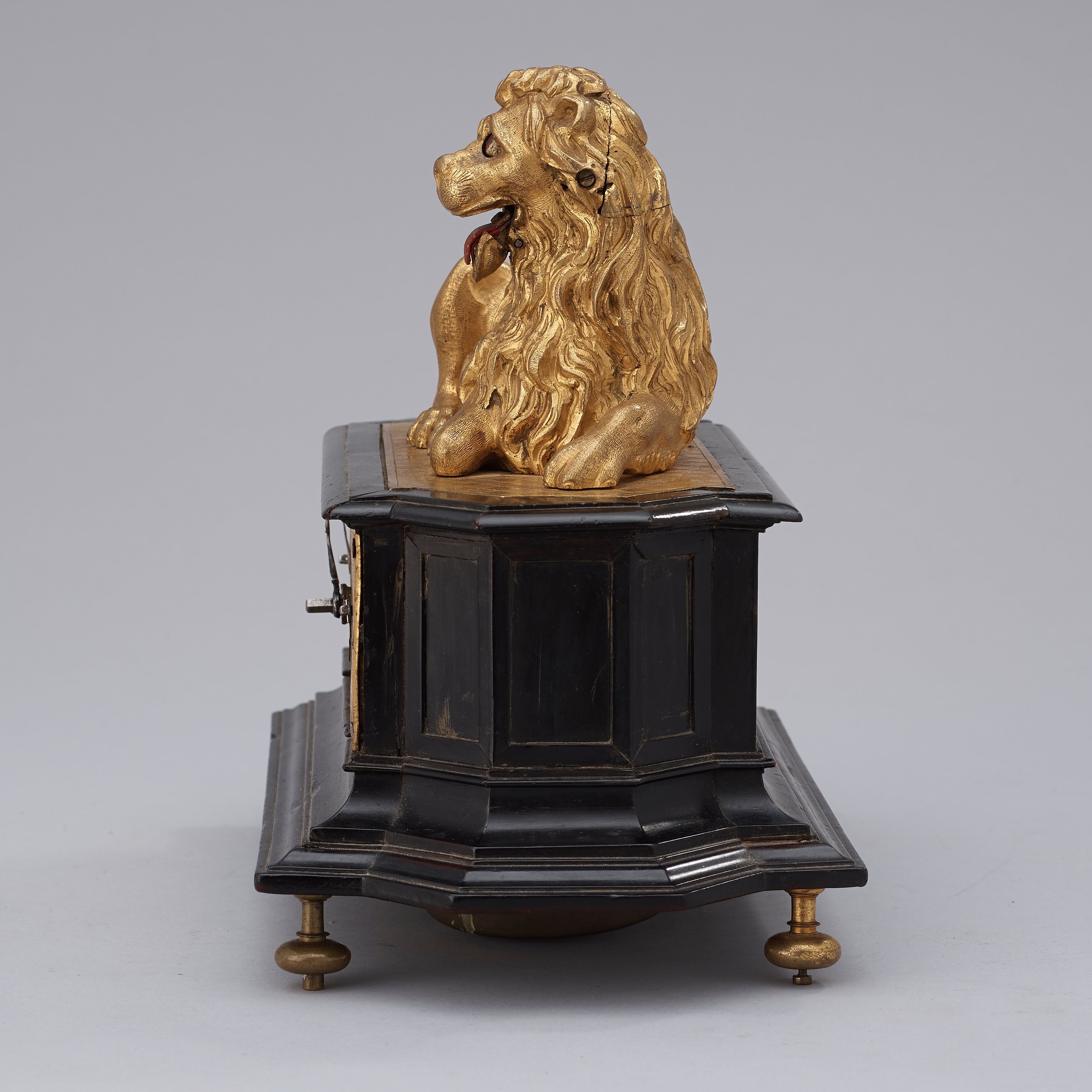A rare gilt brass on ebonised base Lion Automaton figure clock ...