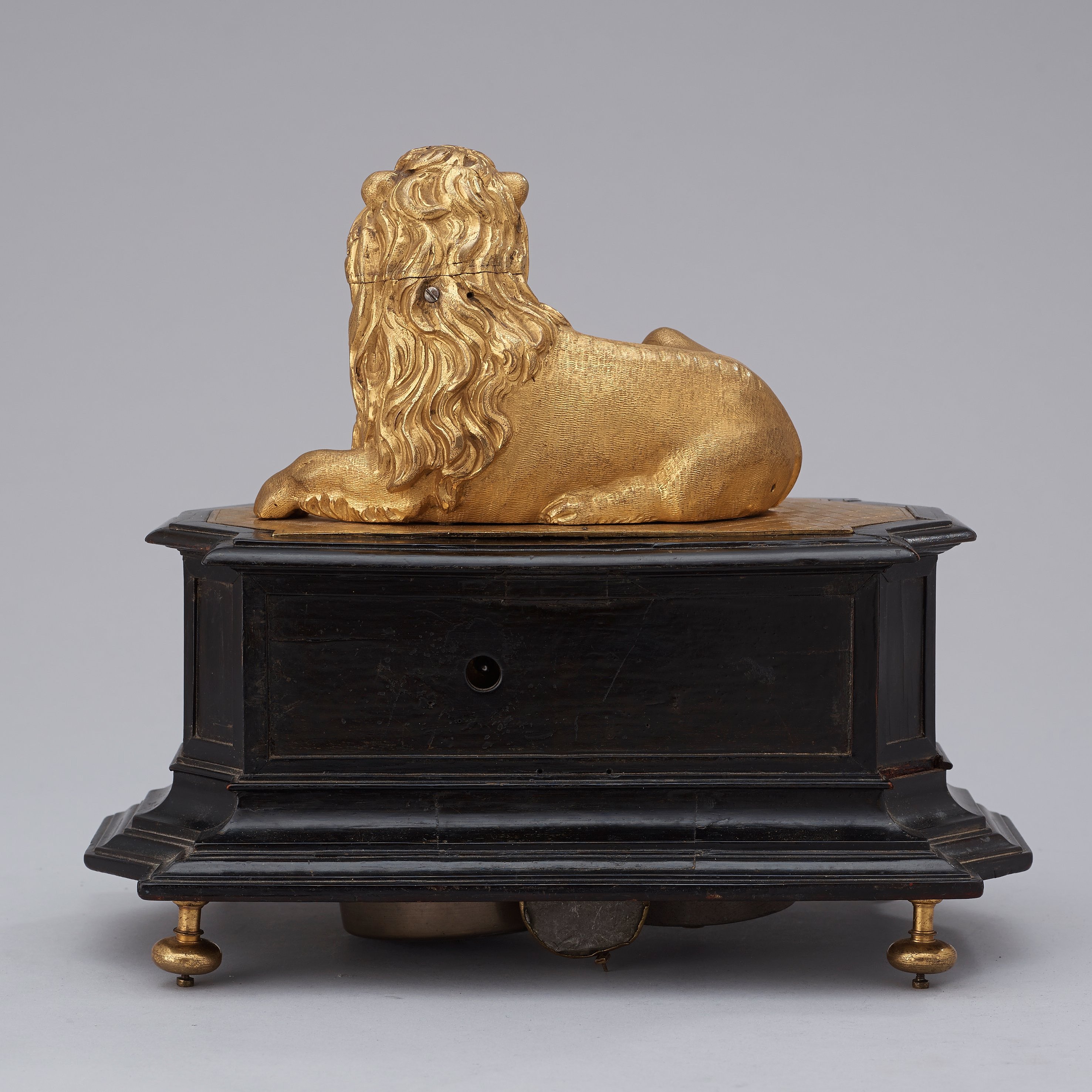 A rare gilt brass on ebonised base Lion Automaton figure clock ...