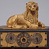 A rare gilt brass on ebonised base Lion Automaton figure clock ...