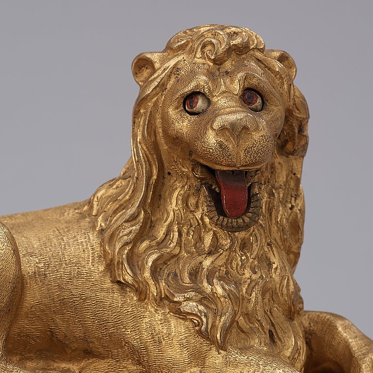 A rare gilt brass on ebonised base Lion Automaton figure clock ...