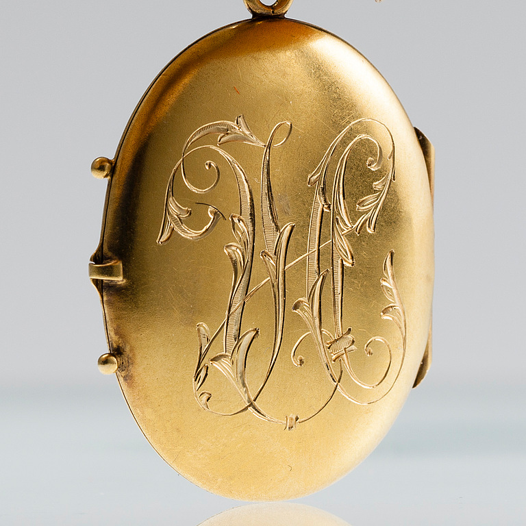 MEDALJONG, 14K guld, sekelskiftet 1800/1900-tal. Vikt 8,1 g. - Bukowskis