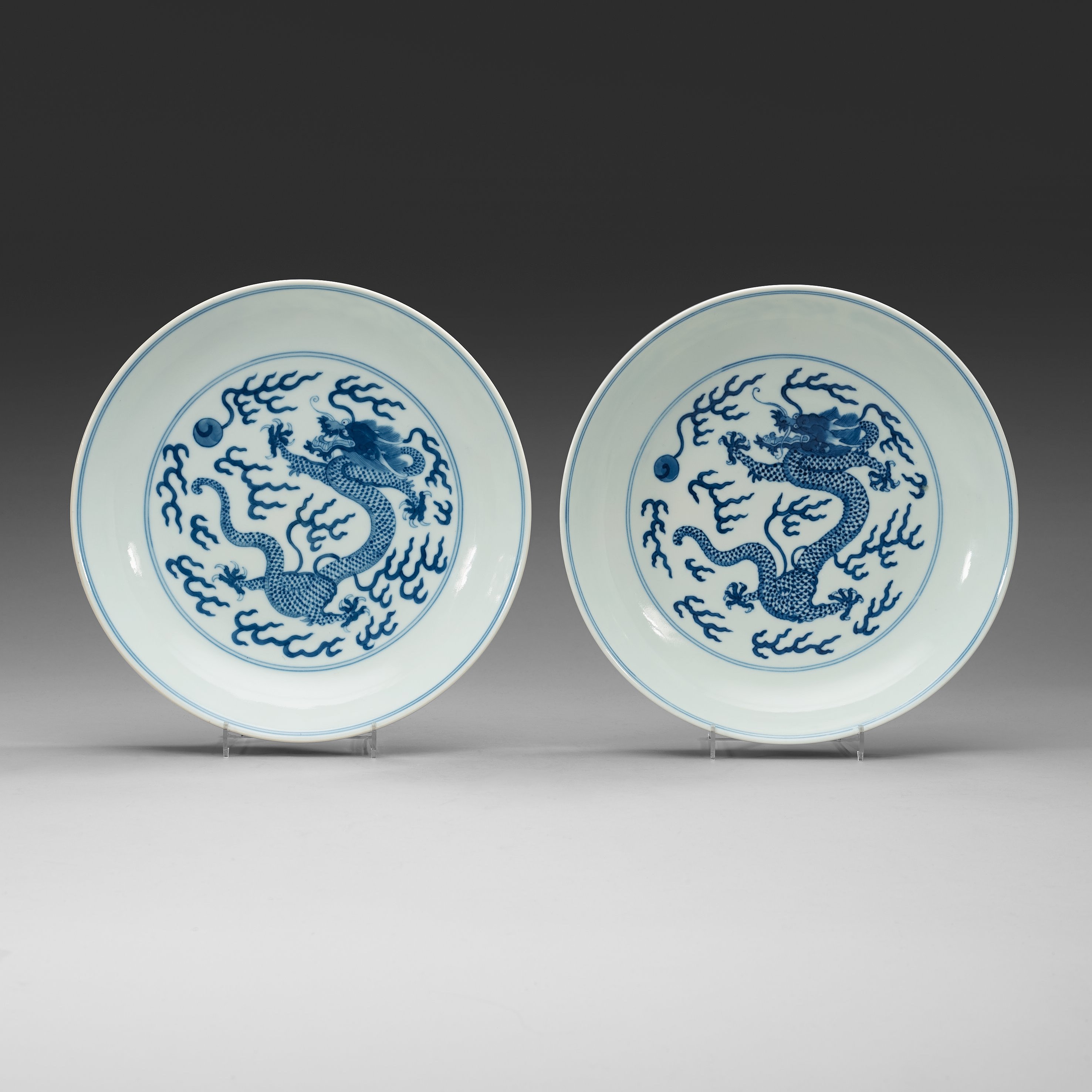 A pair of blue and white 'Dragon dishes', Qing dynasty, Daoguang seal ...