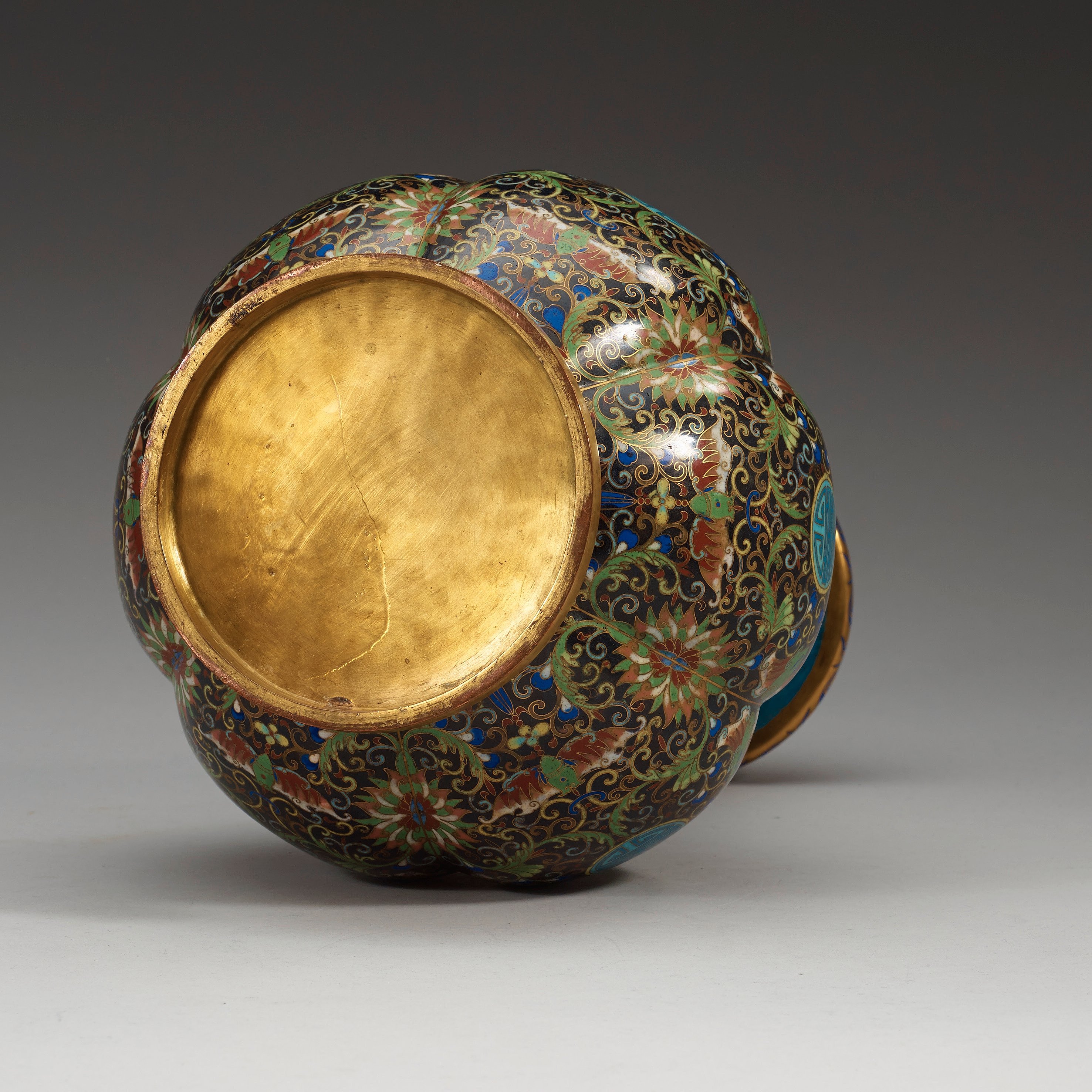 A cloisonné vase decorated with bats and flowers and the character ...