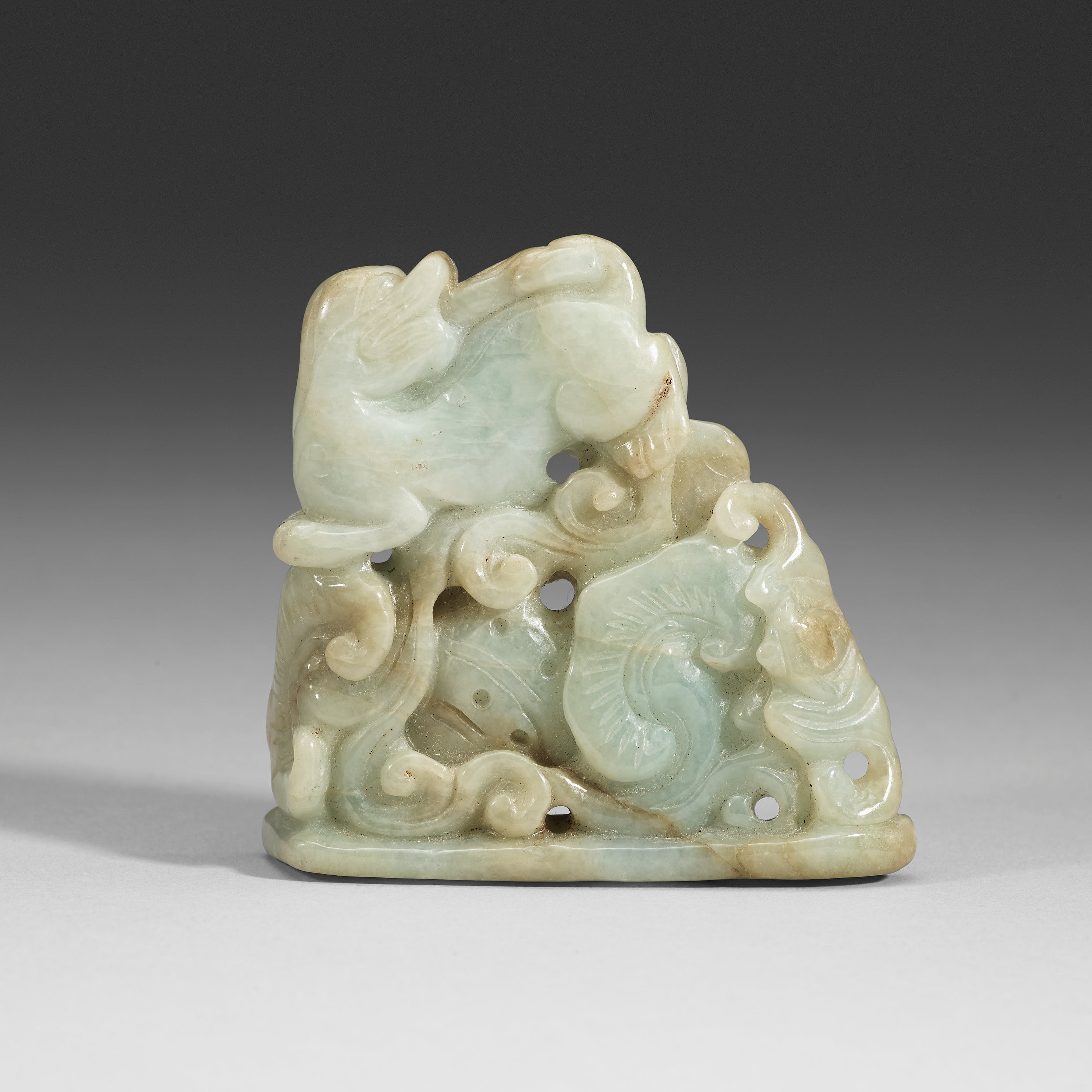 A carved nephrite figurine, presumably late Qing dynasty (1644-1912 ...