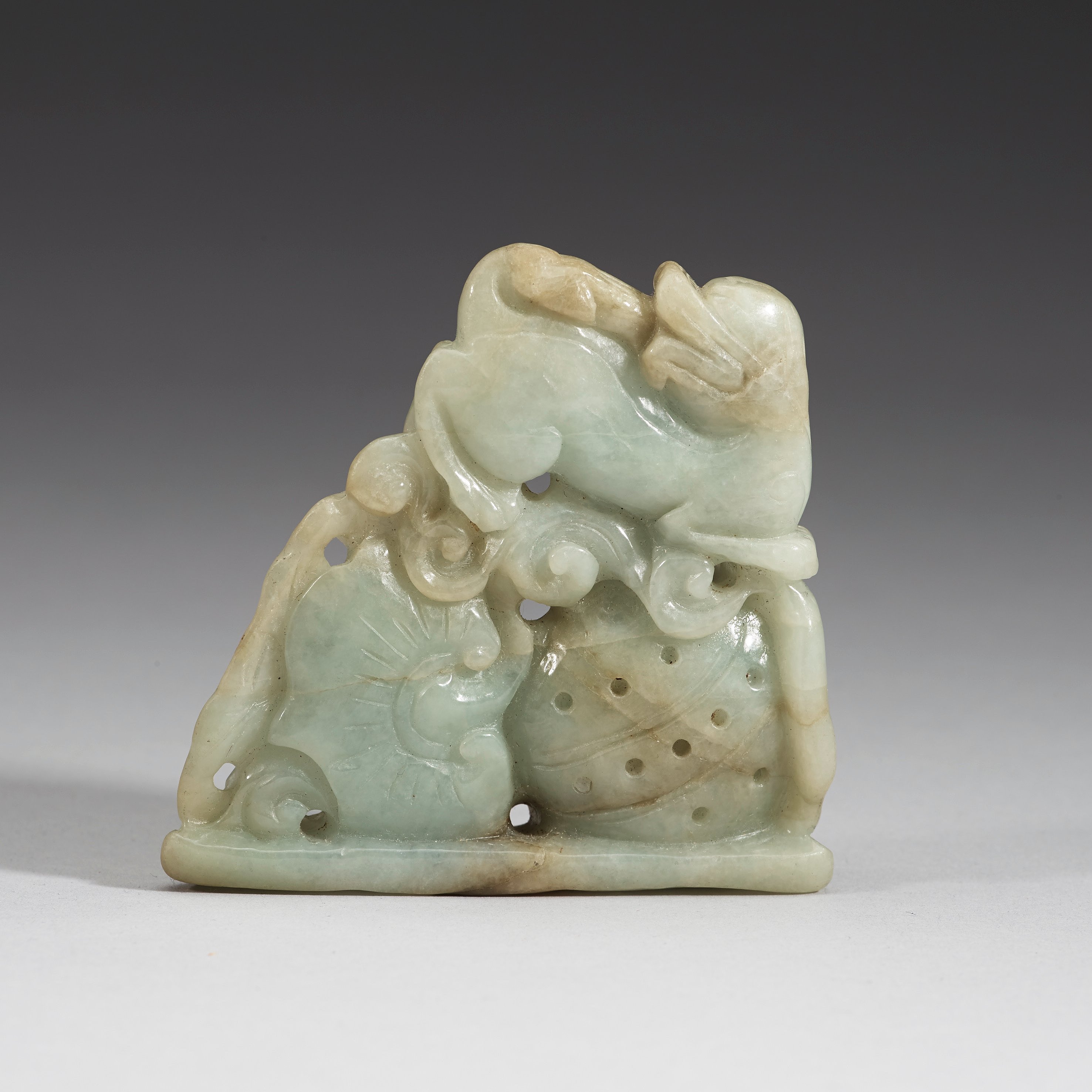 A carved nephrite figurine, presumably late Qing dynasty (1644-1912 ...