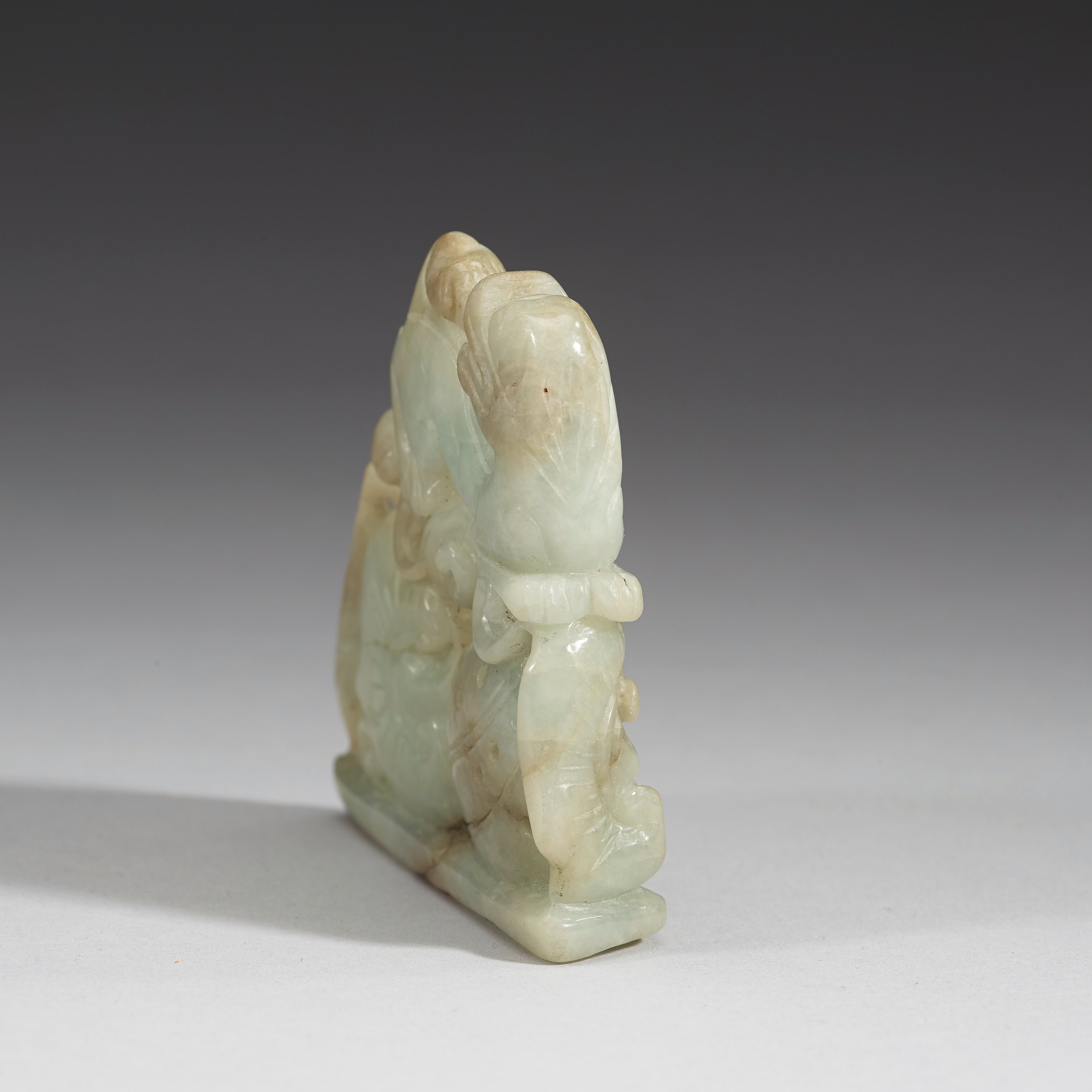 A carved nephrite figurine, presumably late Qing dynasty (1644-1912 ...