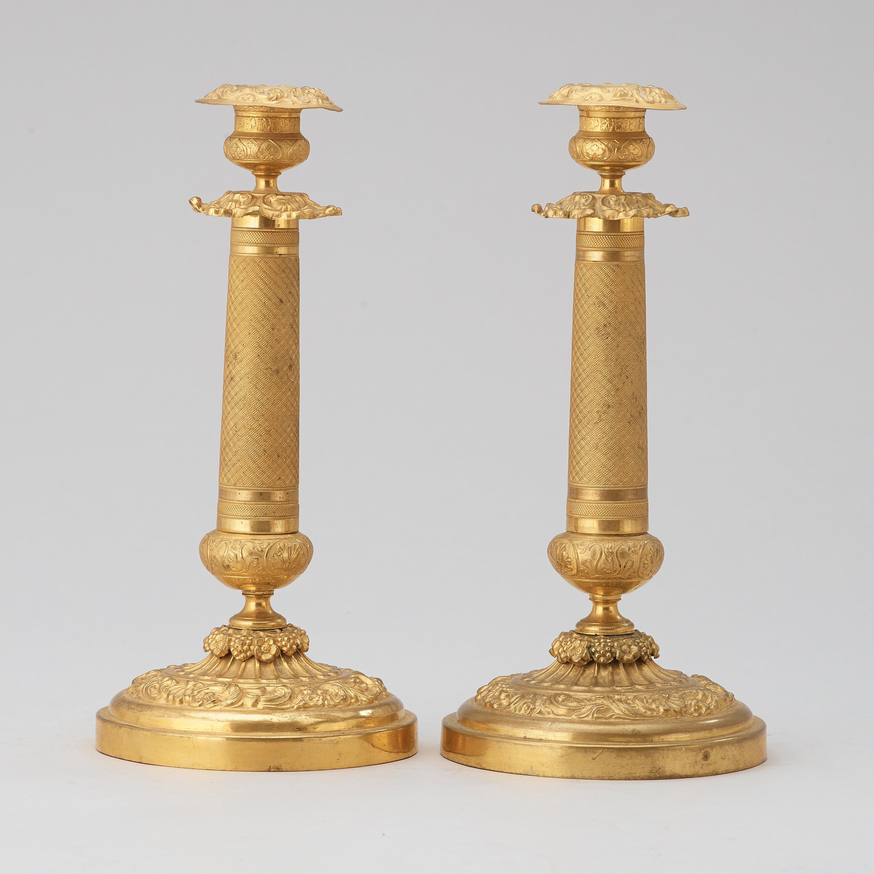A pair of Russian 1830/40's brass candlesticks. - Bukowskis