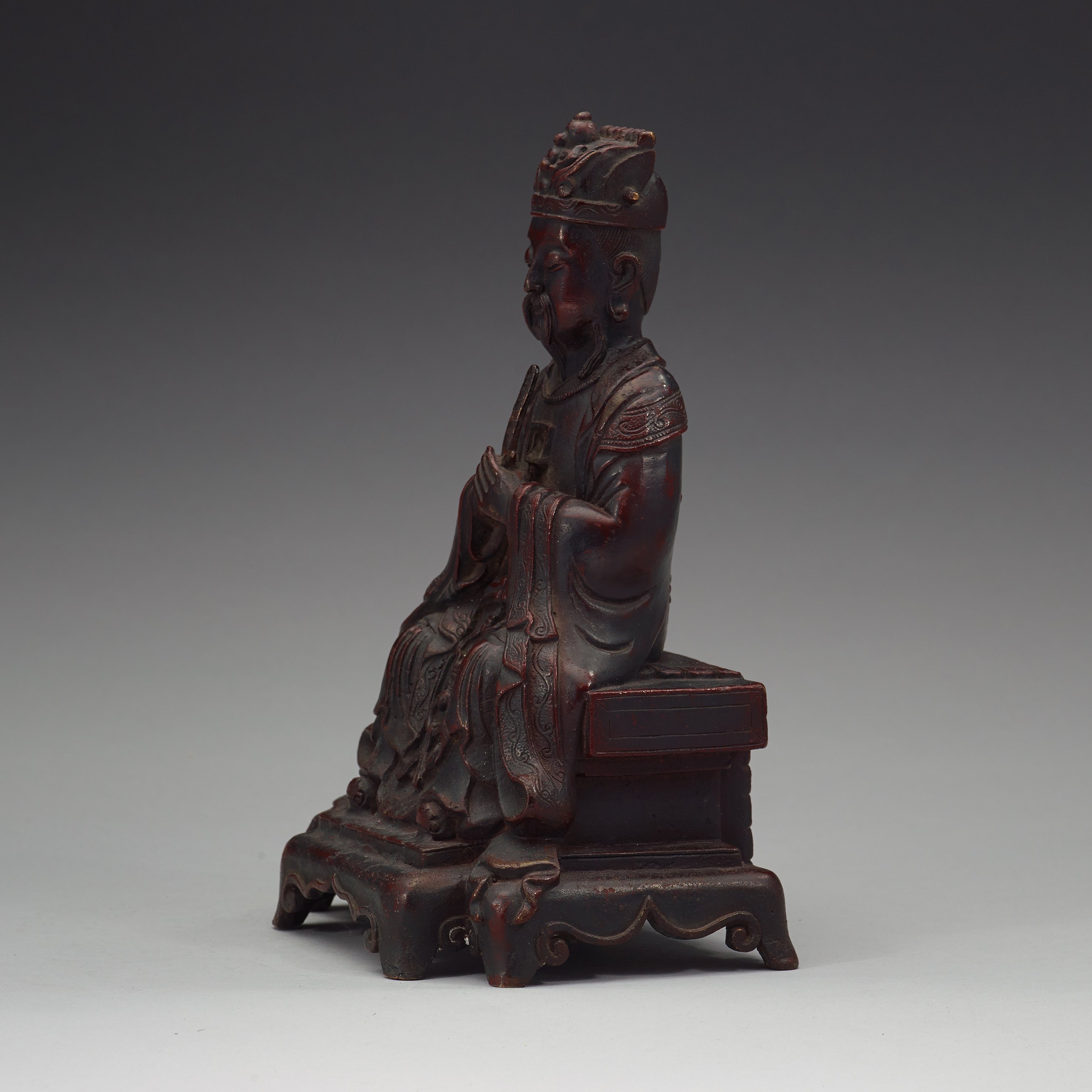 A bronze figure of a daoist deity, Qing dynasty, 18th Century. - Bukowskis