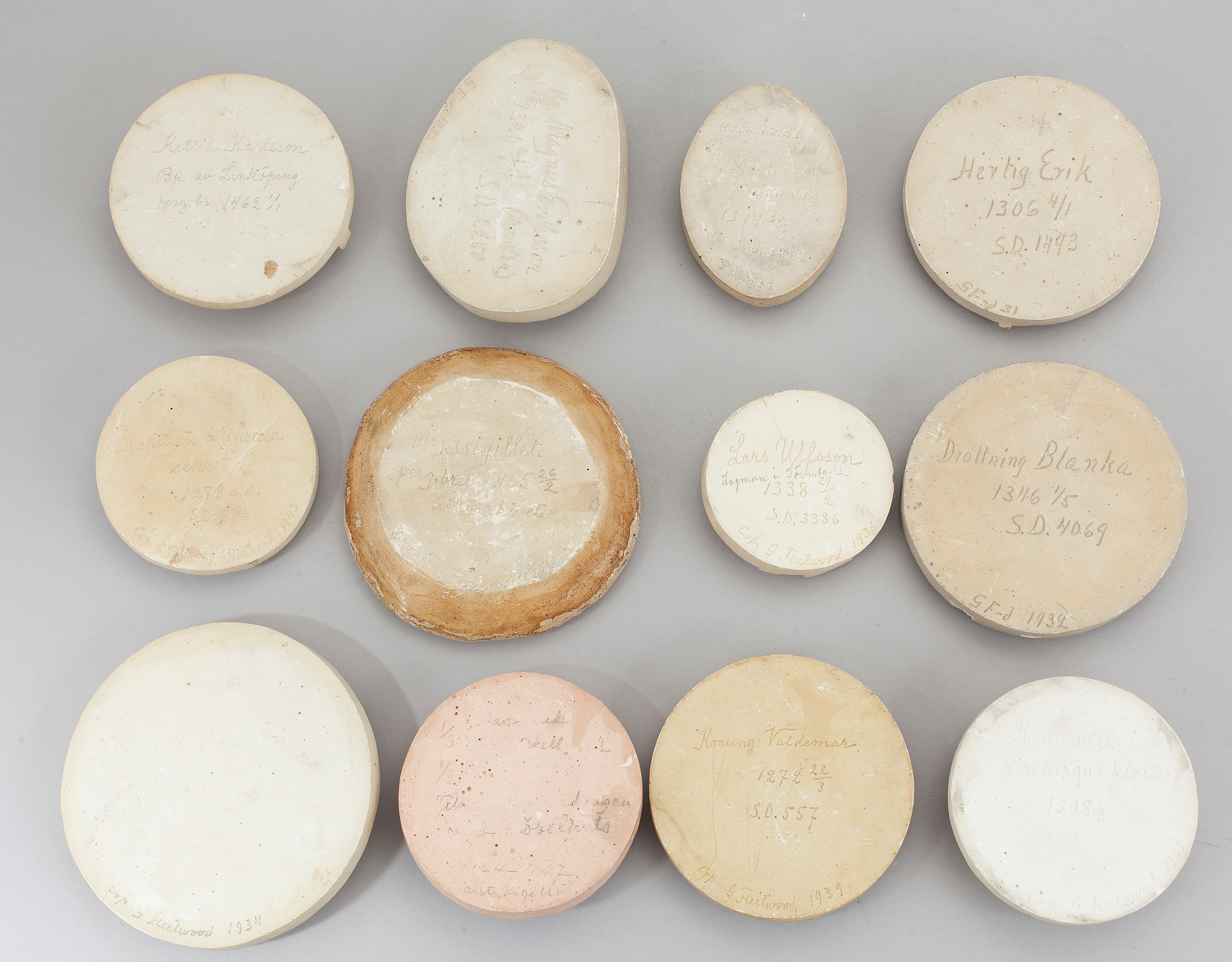 A collection of 12 plaster casts of medieval seals cast by Georg ...