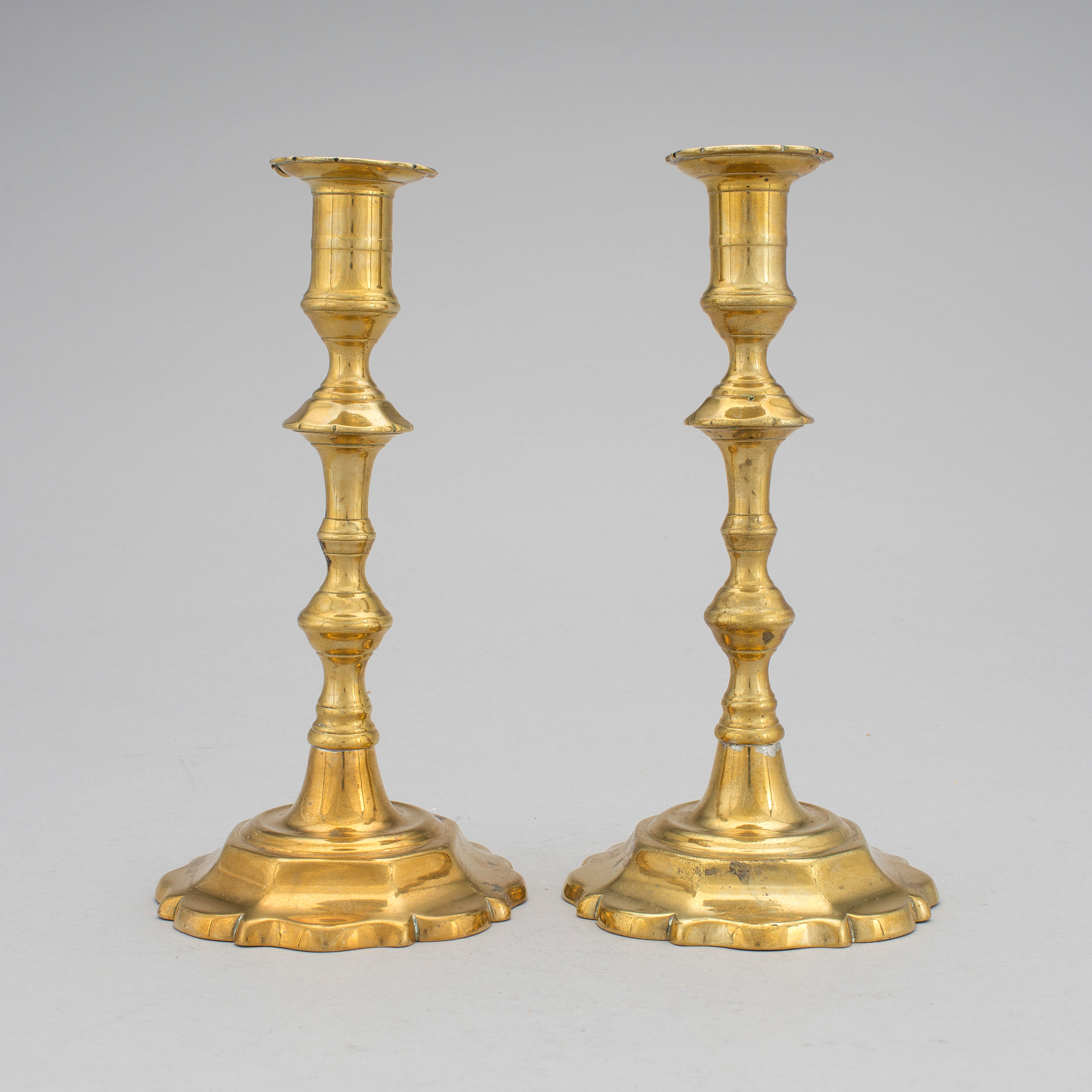 A pair of english candlesticks from the first half of the 18th century ...
