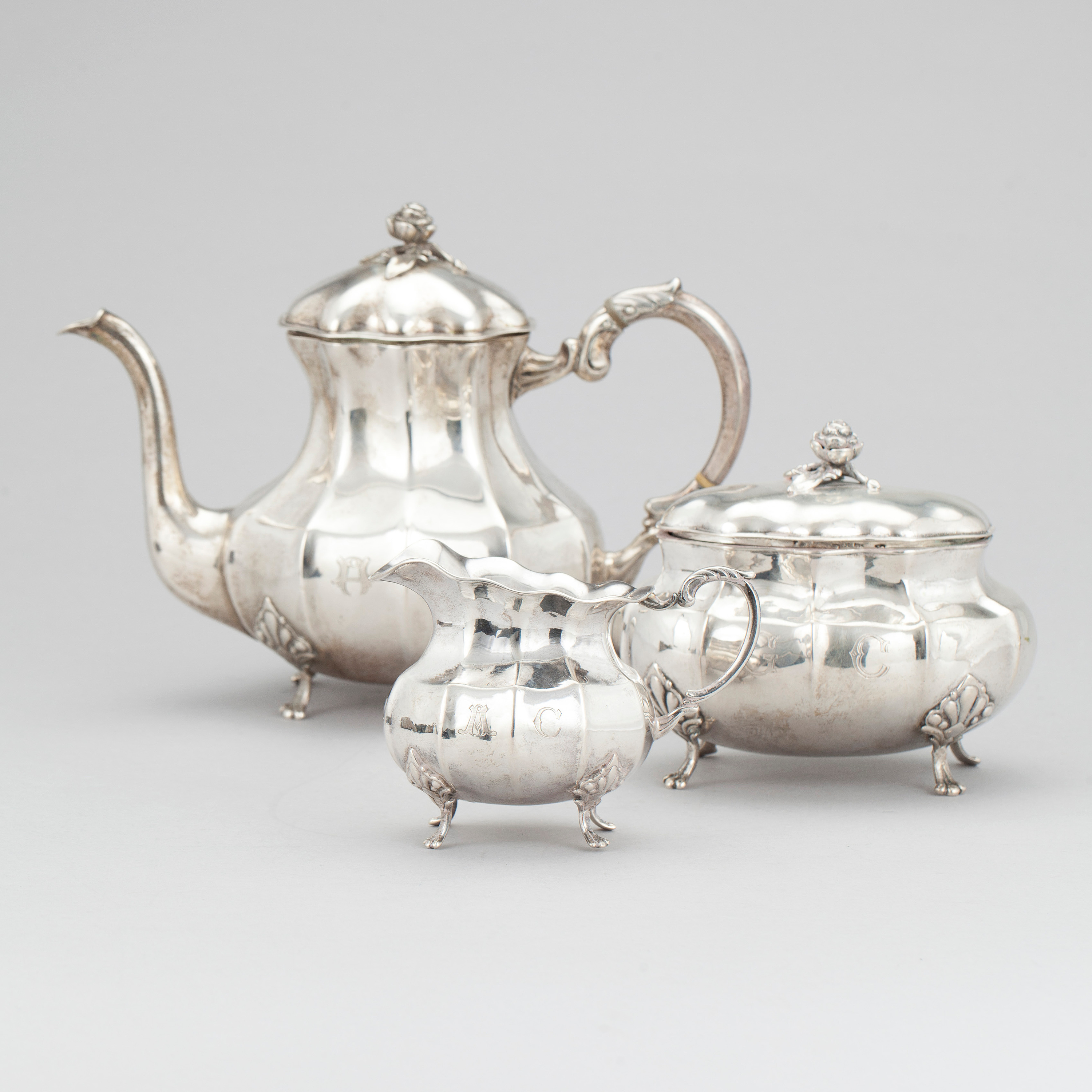 A teapot, sugarbowl and creamer in silver by Hugo Grün, Copenhagen ...