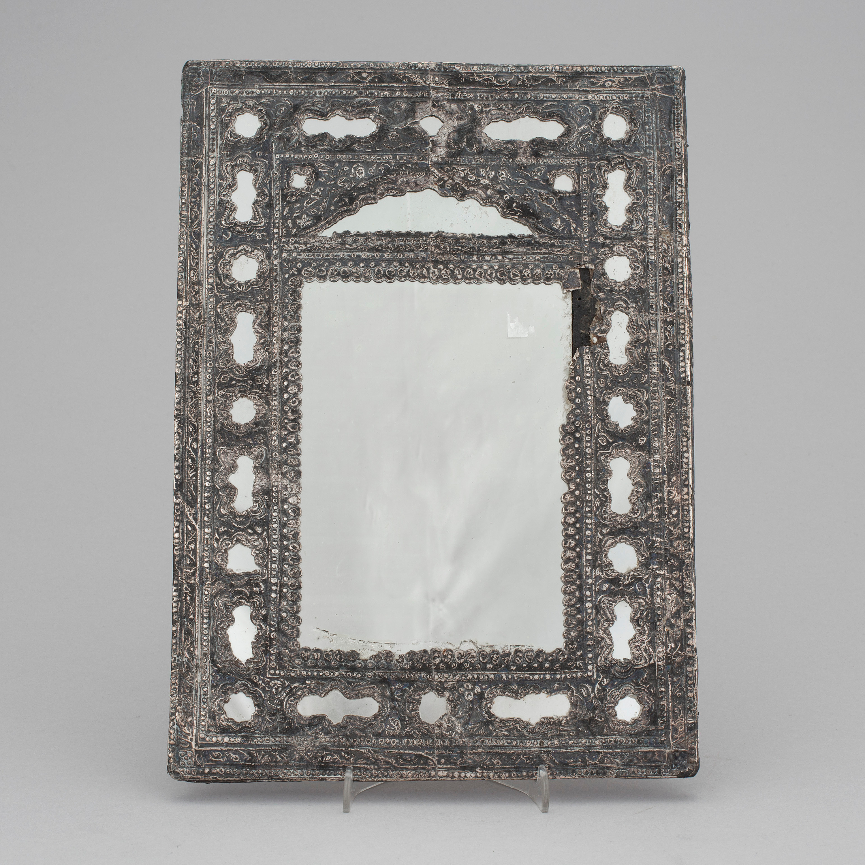 A persian silver mounted mirror, the Qajar dynasty. - Bukowskis