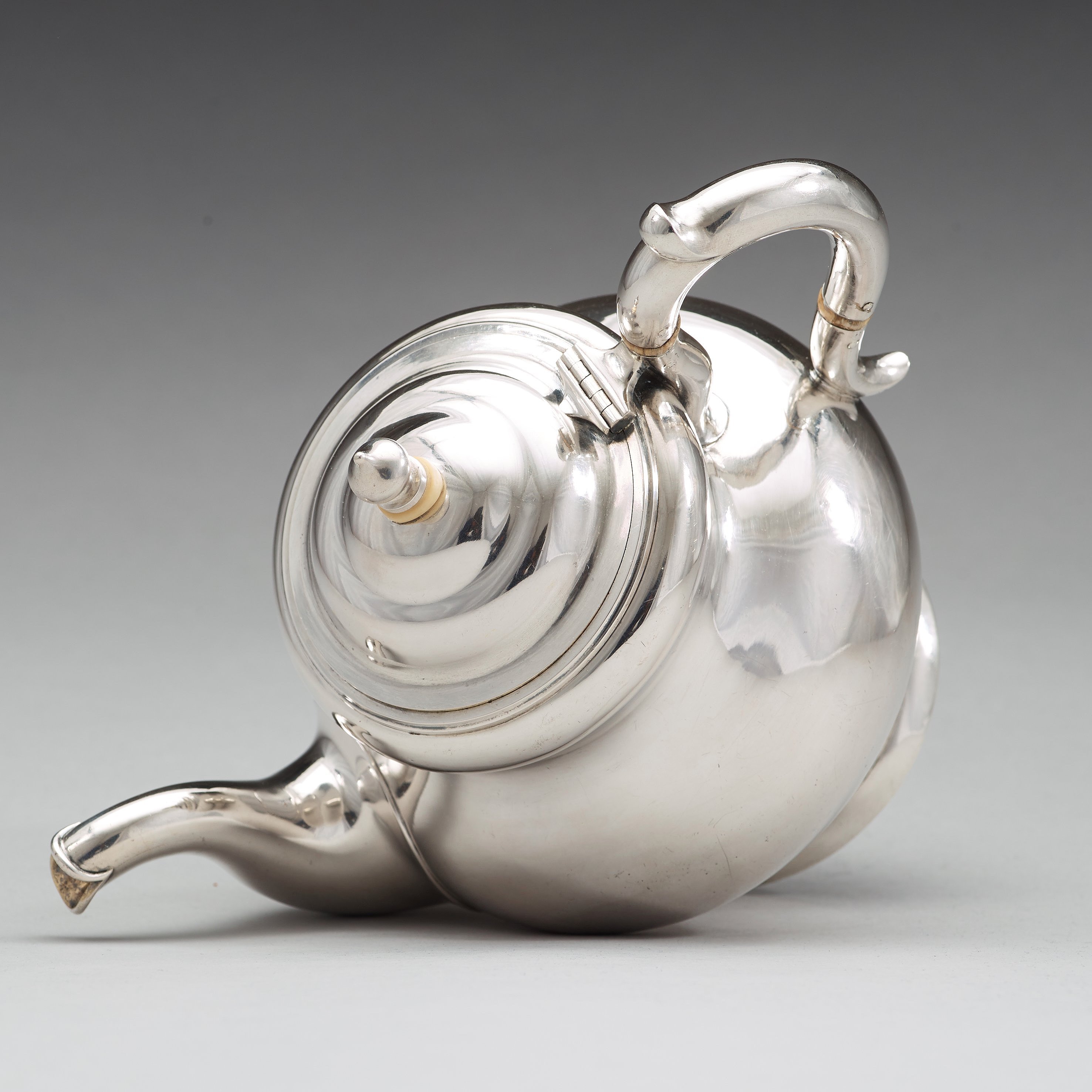 A Russian mid 19th century parcel-gilt tea-pot, mark of Michael Peippo ...