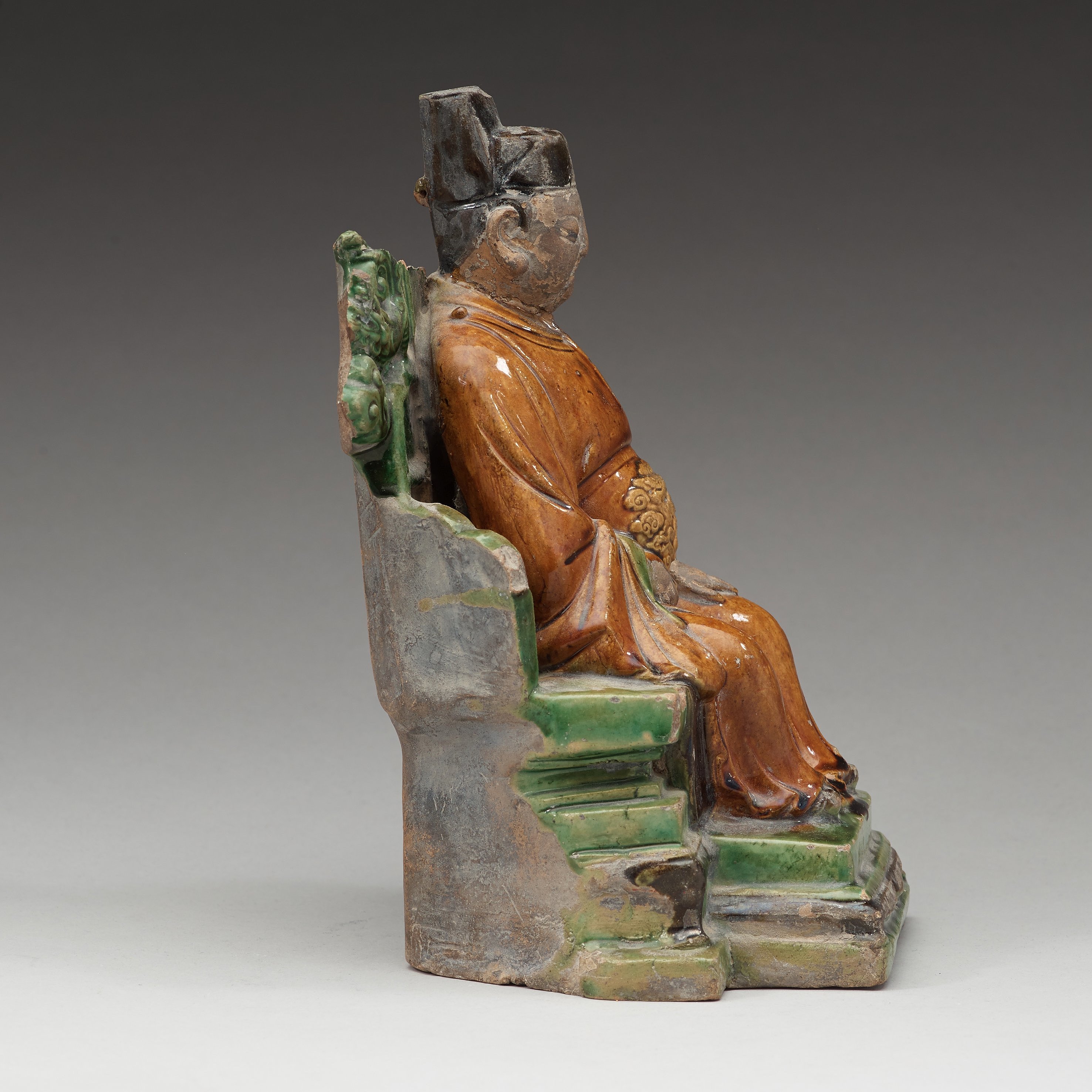 A ceramic sculpture of a seated daoist dignitary, Ming dynasty, (1368 ...