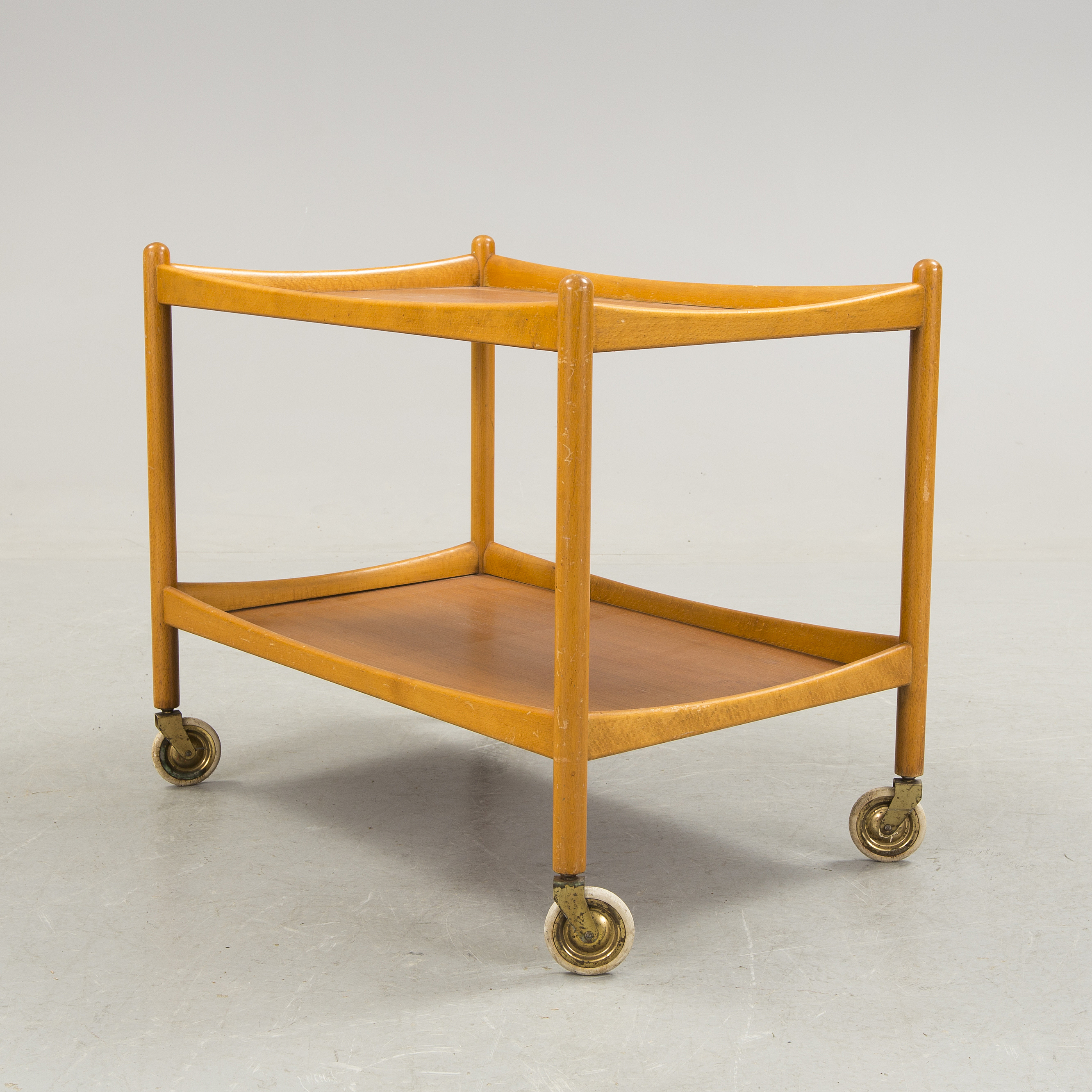 A teak and birch tree trolley, mid 20th century. - Bukowskis