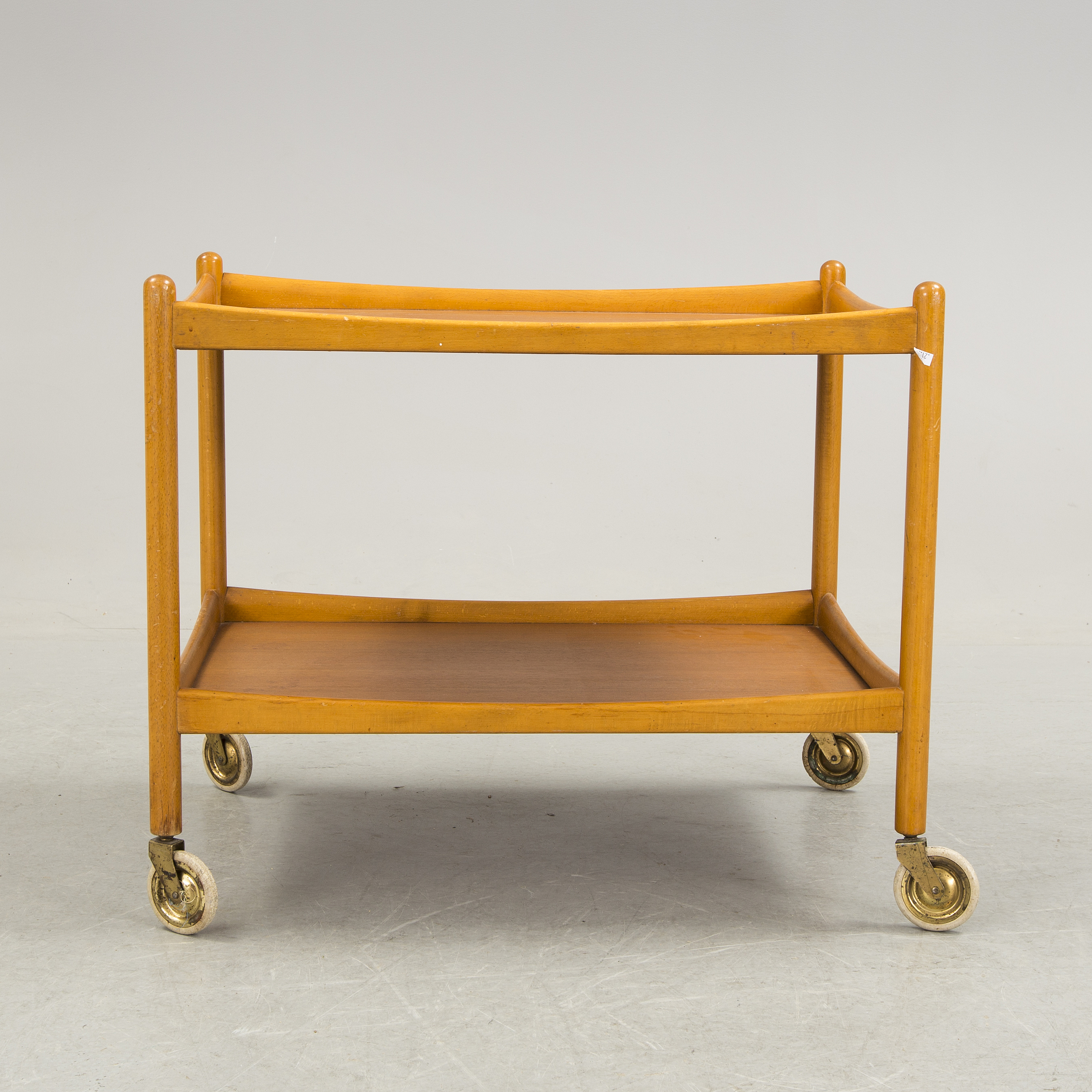 A teak and birch tree trolley, mid 20th century. - Bukowskis