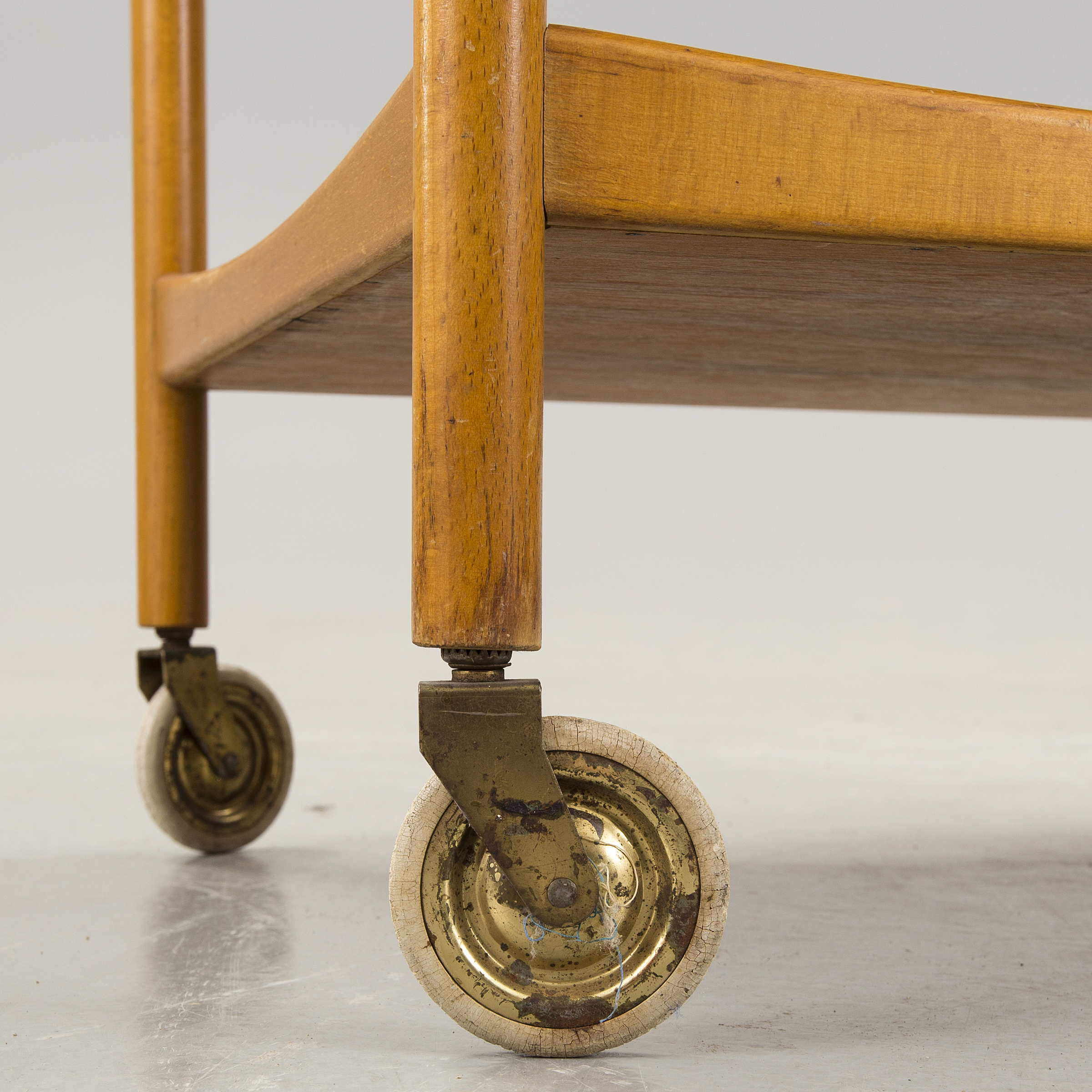 A teak and birch tree trolley, mid 20th century. - Bukowskis