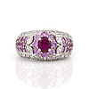 A ring set with an oval, mixed-cut ruby, pink sapphires and diamonds ...