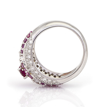 A ring set with an oval, mixed-cut ruby, pink sapphires and diamonds ...