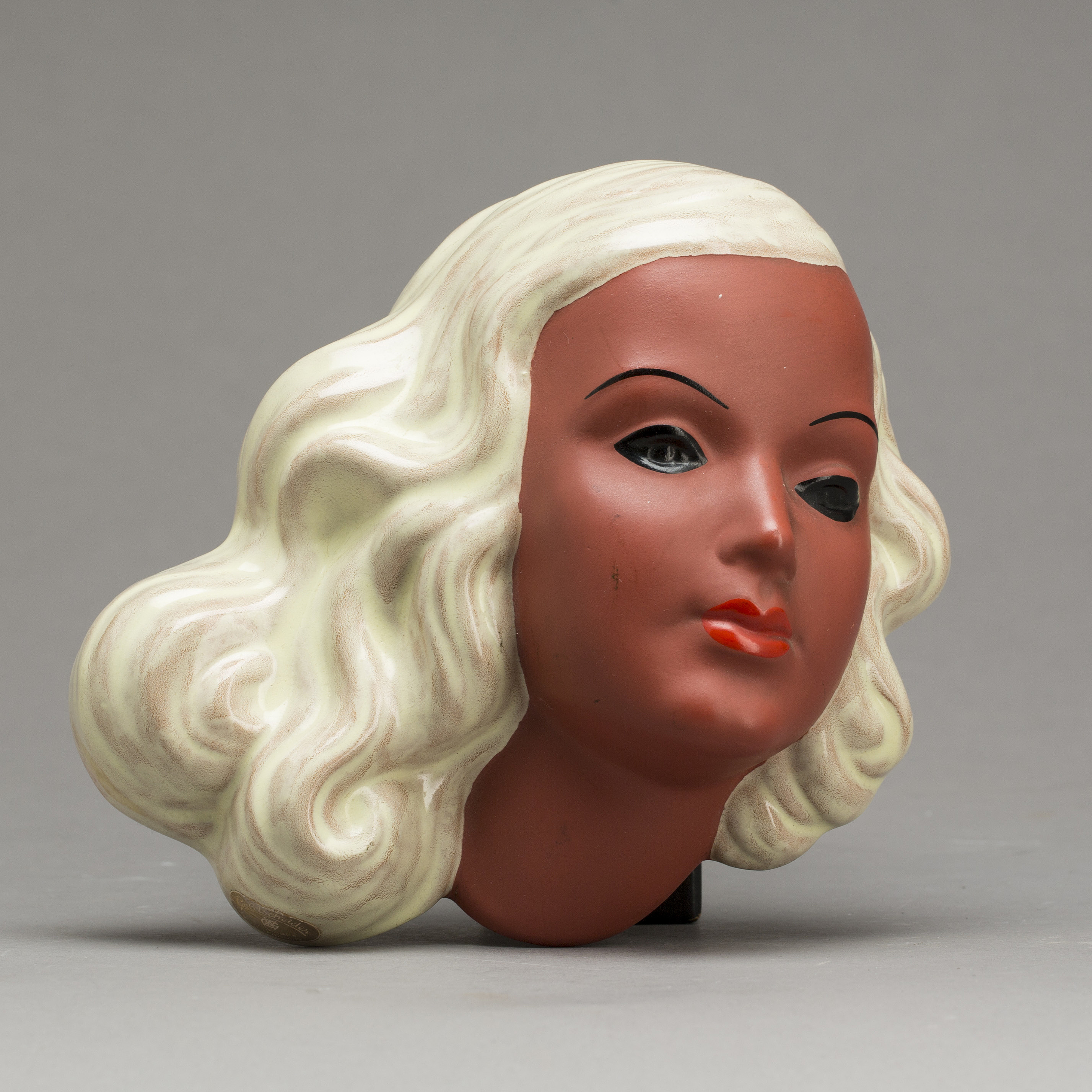 An Adolf Prischl terracotta wall mask for Goldscheider, mid 1900 ...