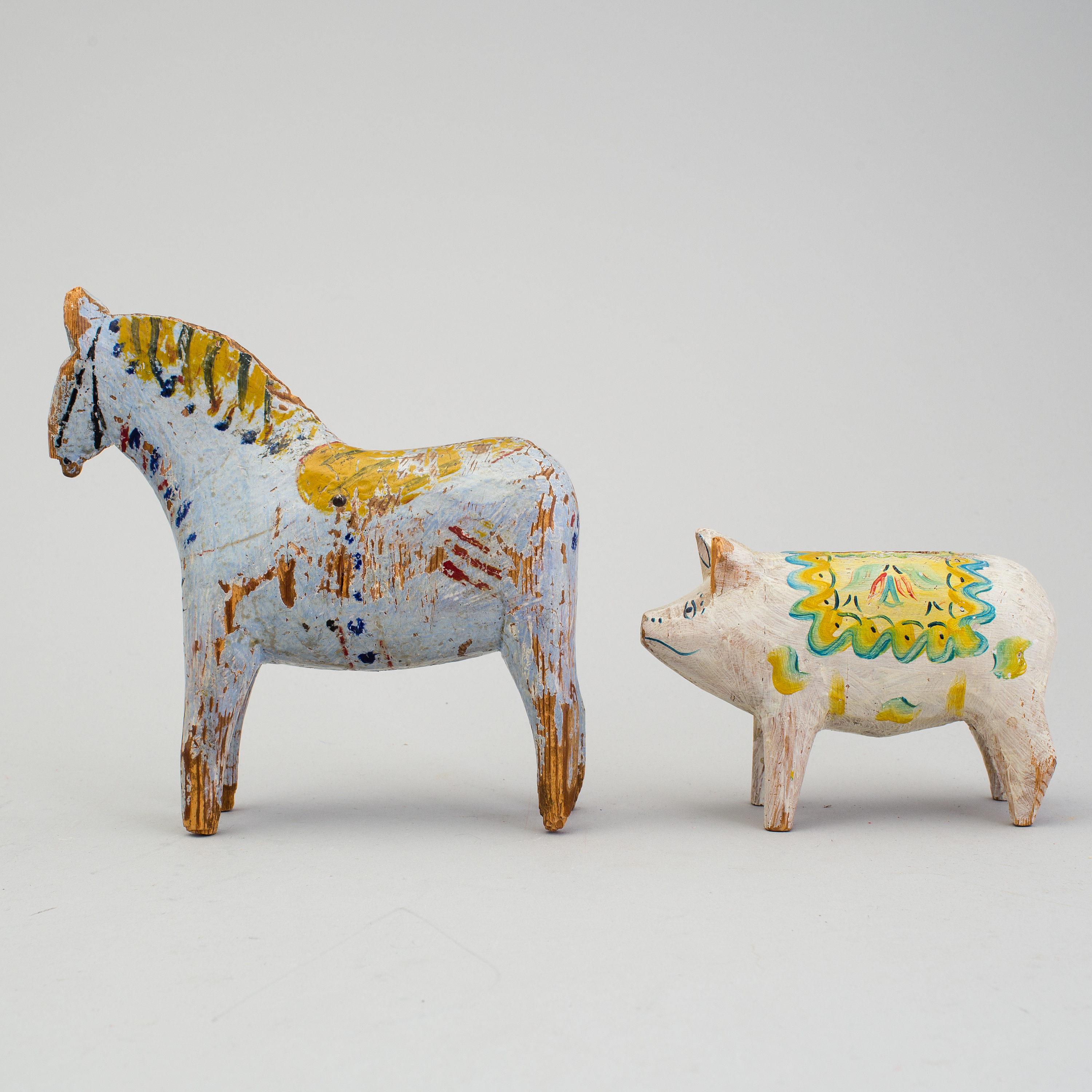 A painted folk art dala horse and dala pig, first half of the 20th ...