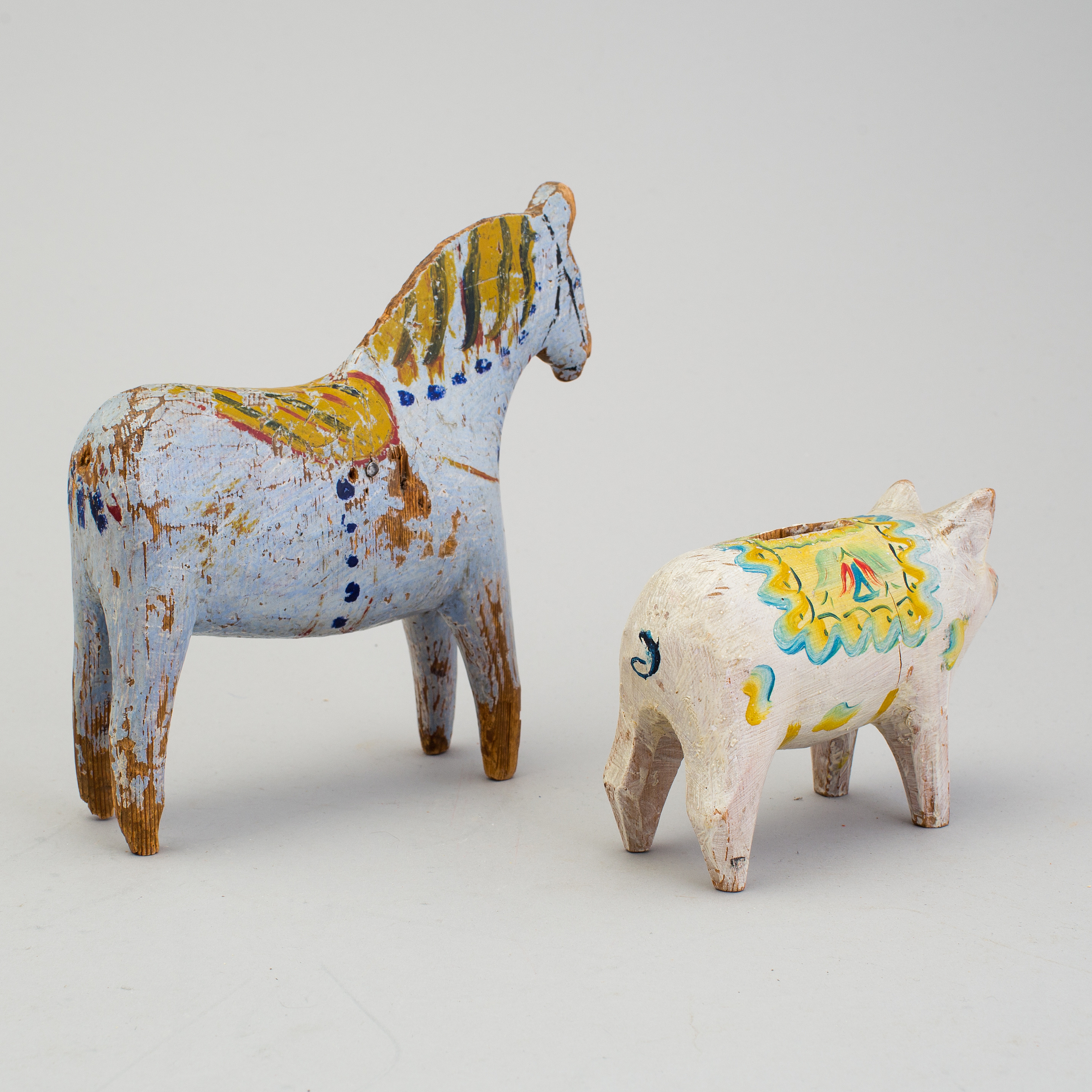 A painted folk art dala horse and dala pig, first half of the 20th ...