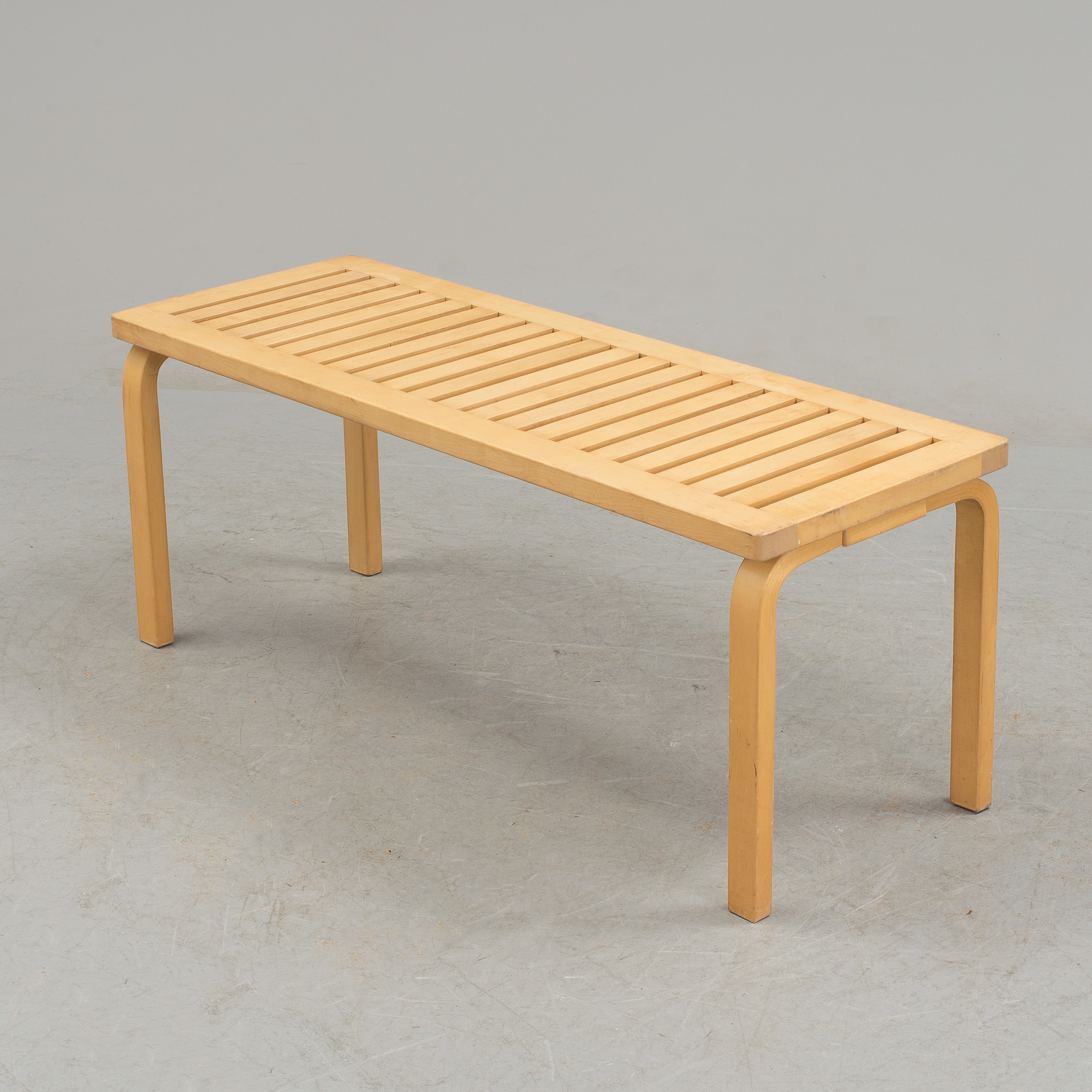 A late 20th century birch bench model 153B designed by Alvar Aalto ...