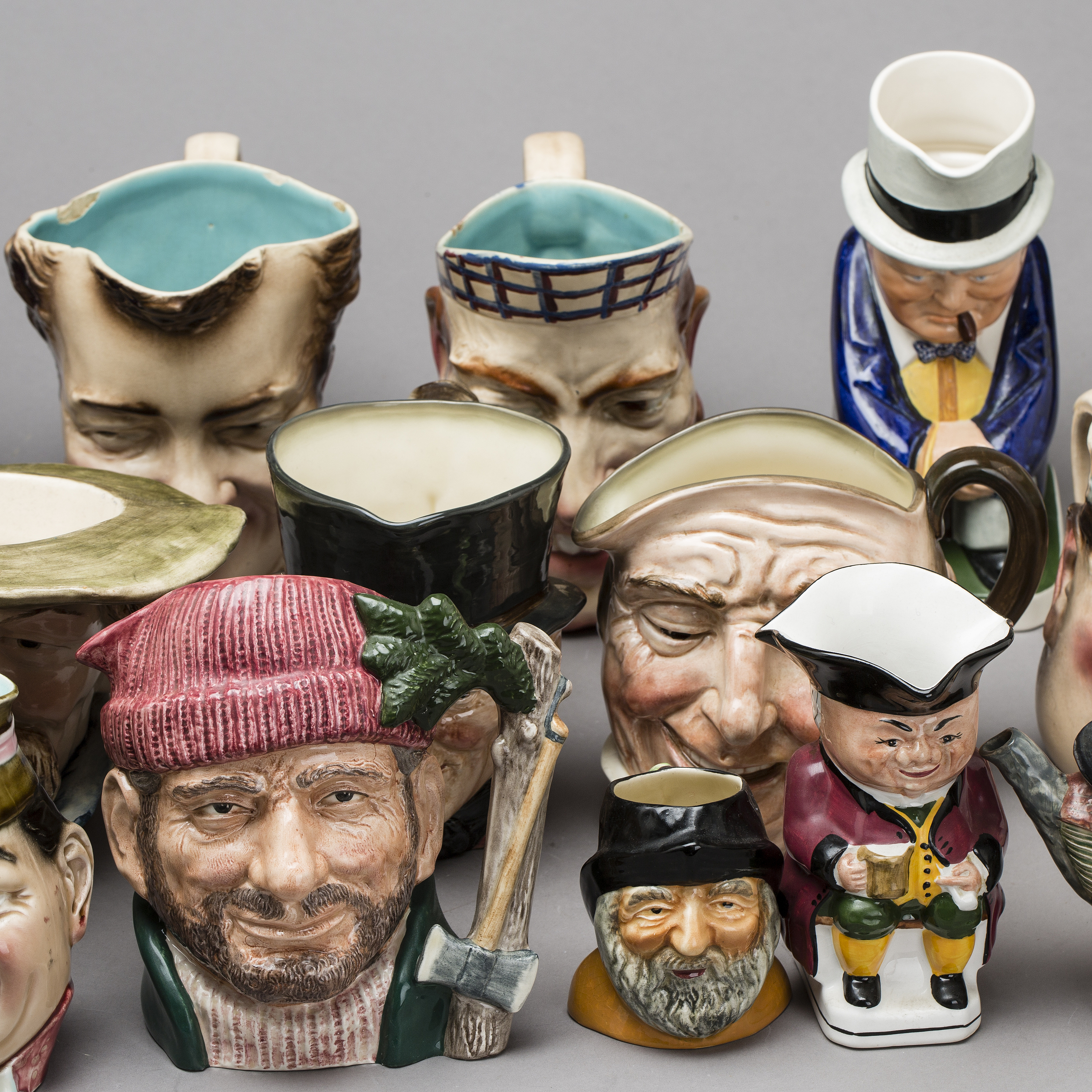 A COLLECTION OF TOBY JUGS, MOSTLY ROYAL DOULTON AND SARREGUEMINES, 20TH ...