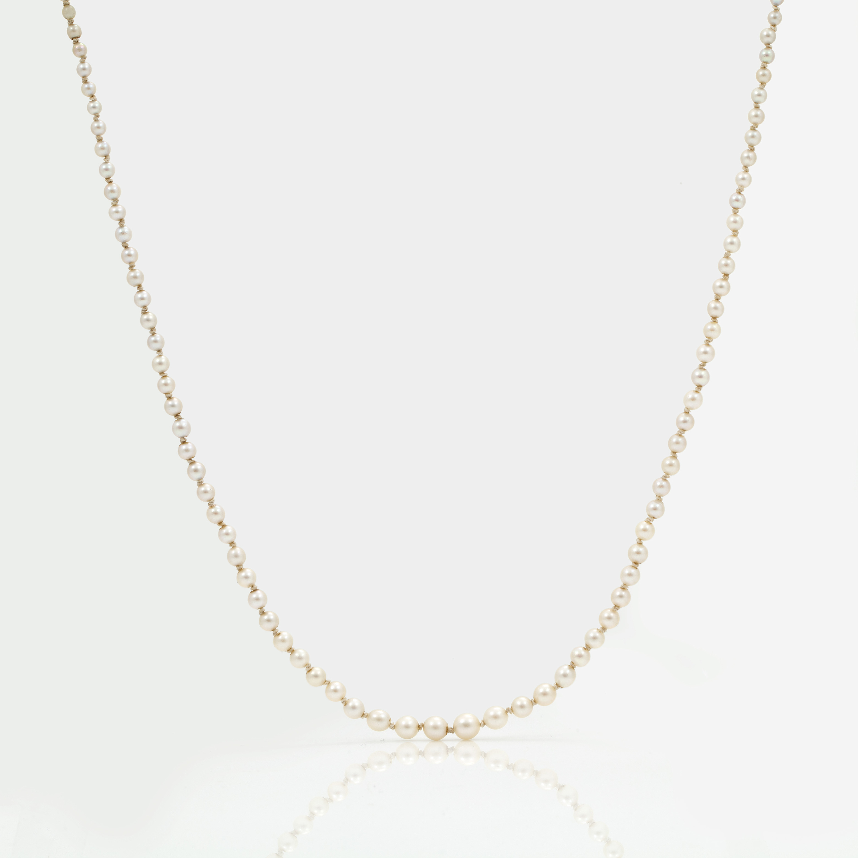 A cultured and possibly natural saltwater pearl necklace. Clasp with ...