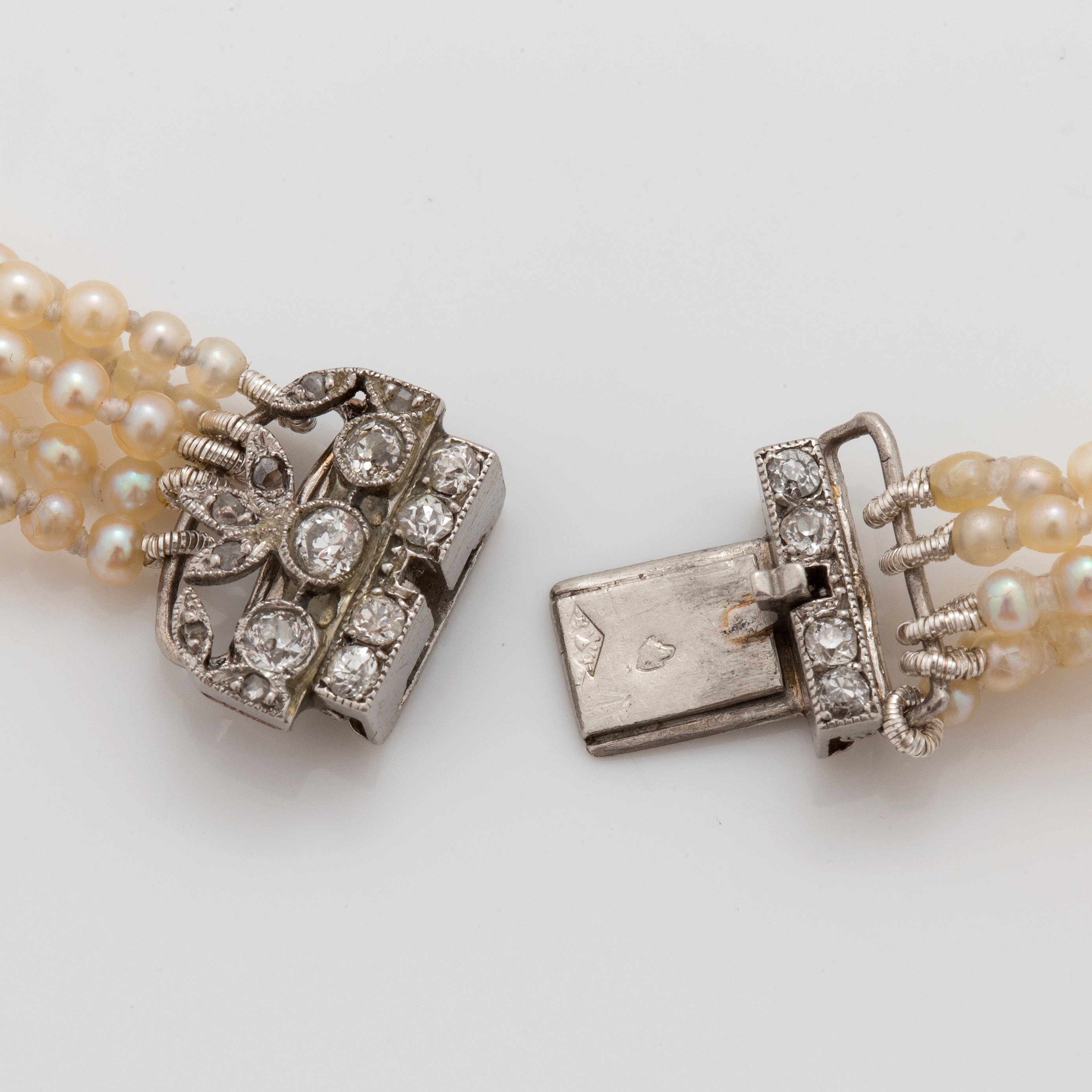 A 5-strand natural saltwater pearl necklace (one pearl cultured) Clasp ...