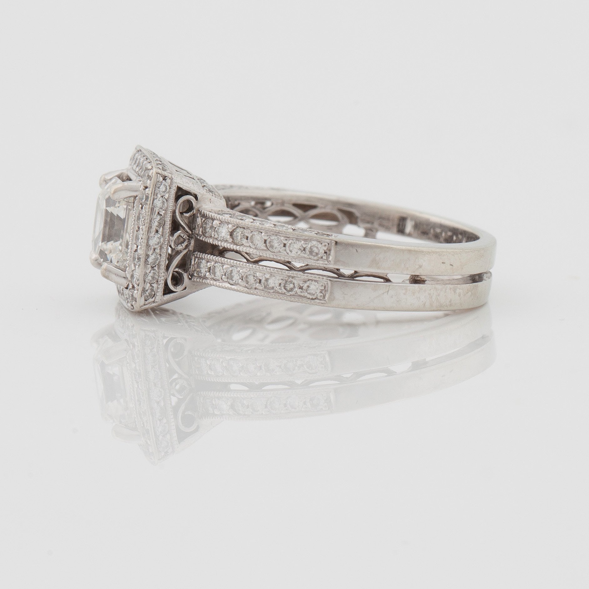 A 1.04 ct Assher cut diamond, quality F/VS1, ring. Shan with pavé set ...