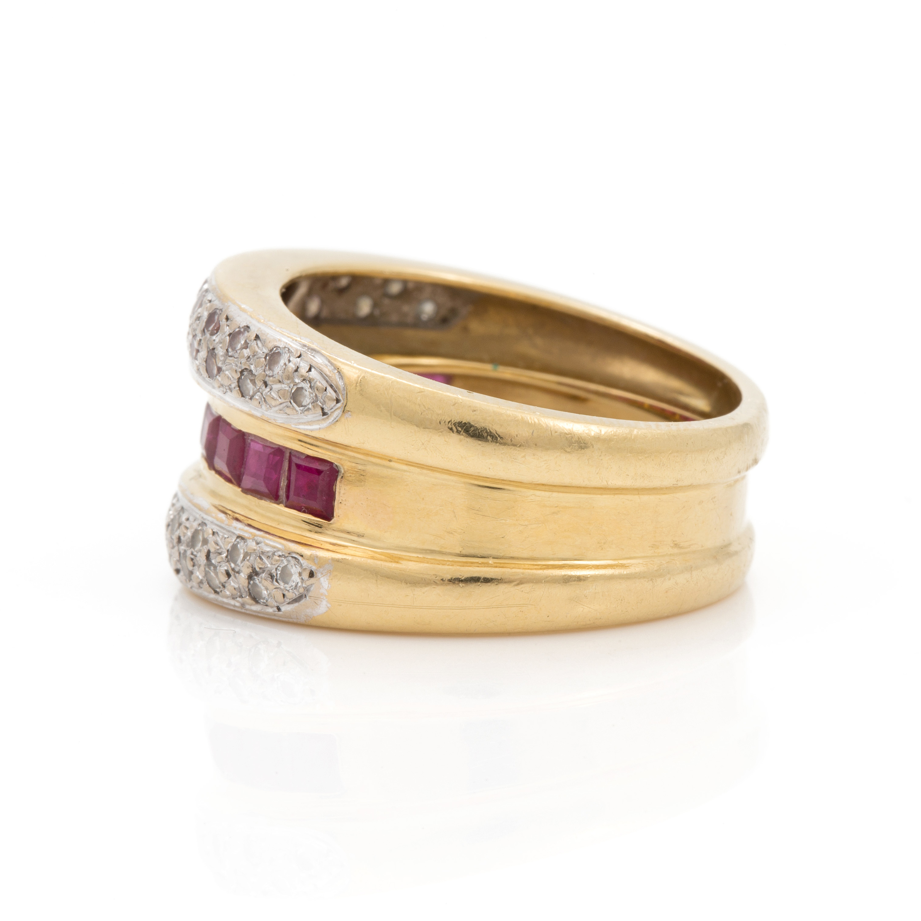 A step cut ruby and brilliant cut diamond ring. Total carat weight of ...