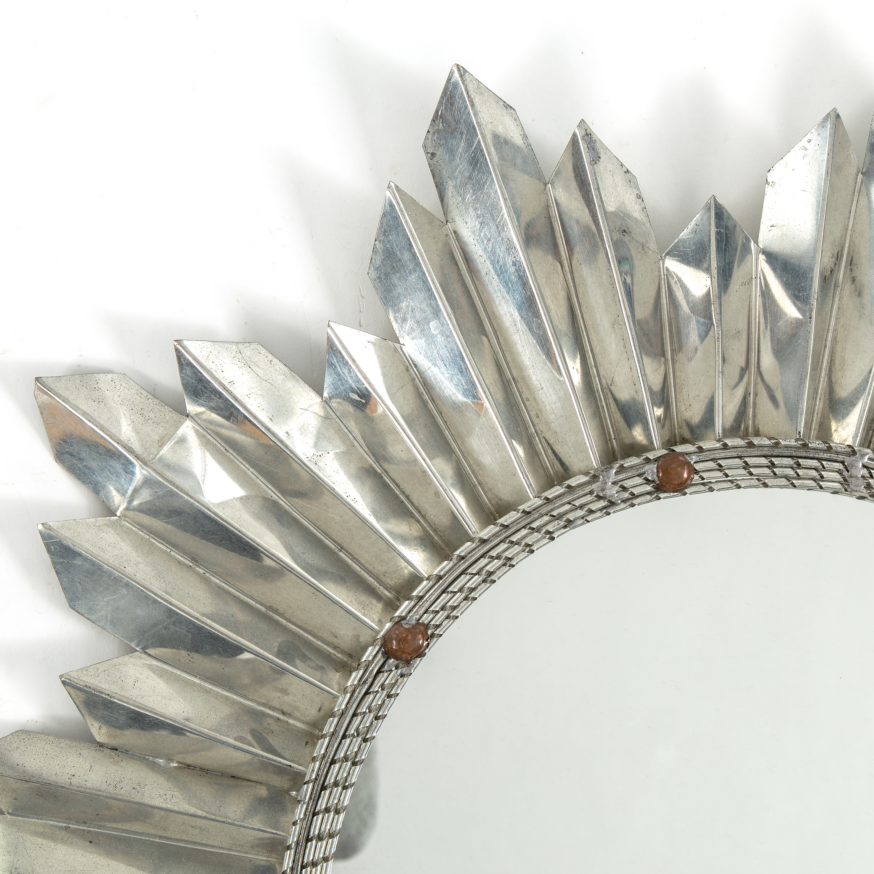 Mirror with steel decoration forming a sun. Diam 75 cm. - Bukowskis