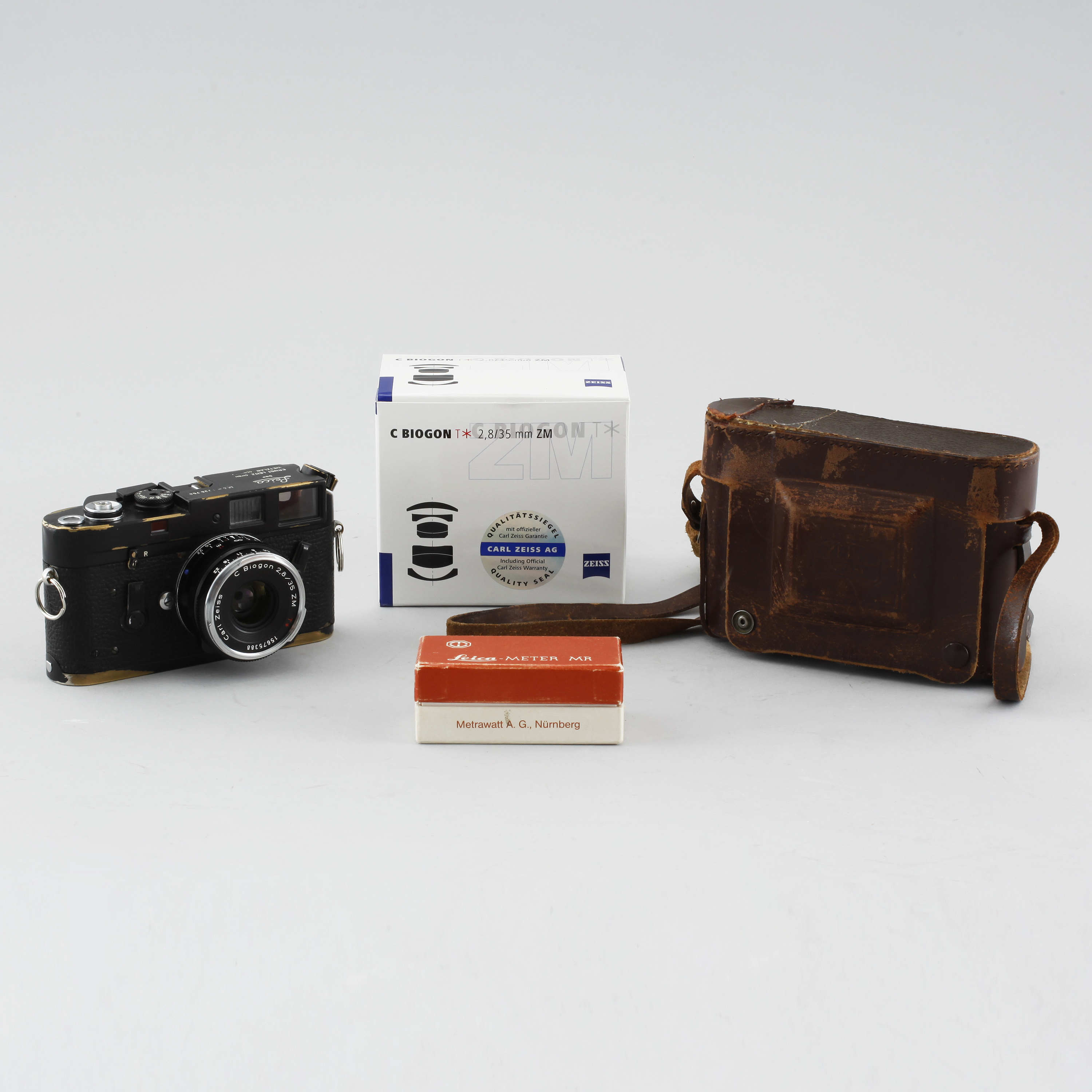 Two cameras from Leica and Zeiss Ikon with accessories, 20th/21st ...