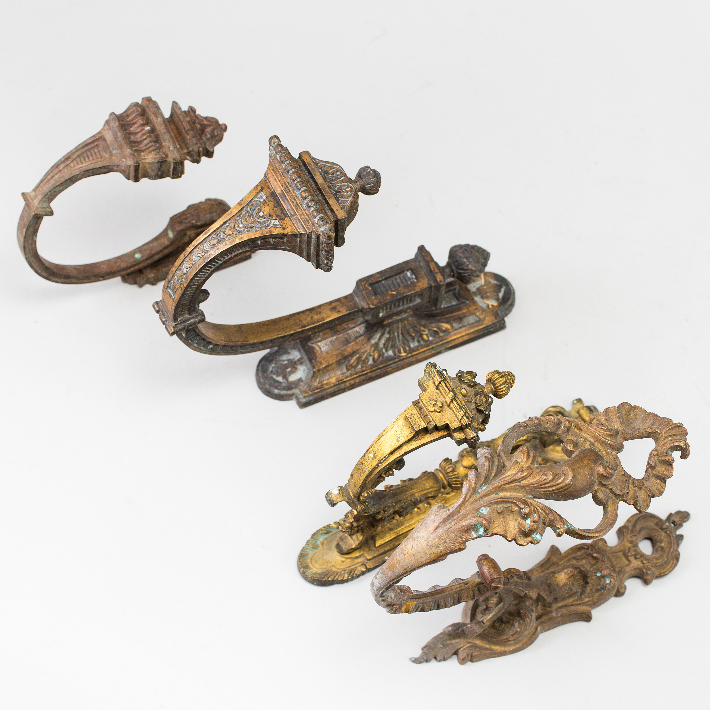 A set of four bronze tie-backs, mid 19th century. - Bukowskis