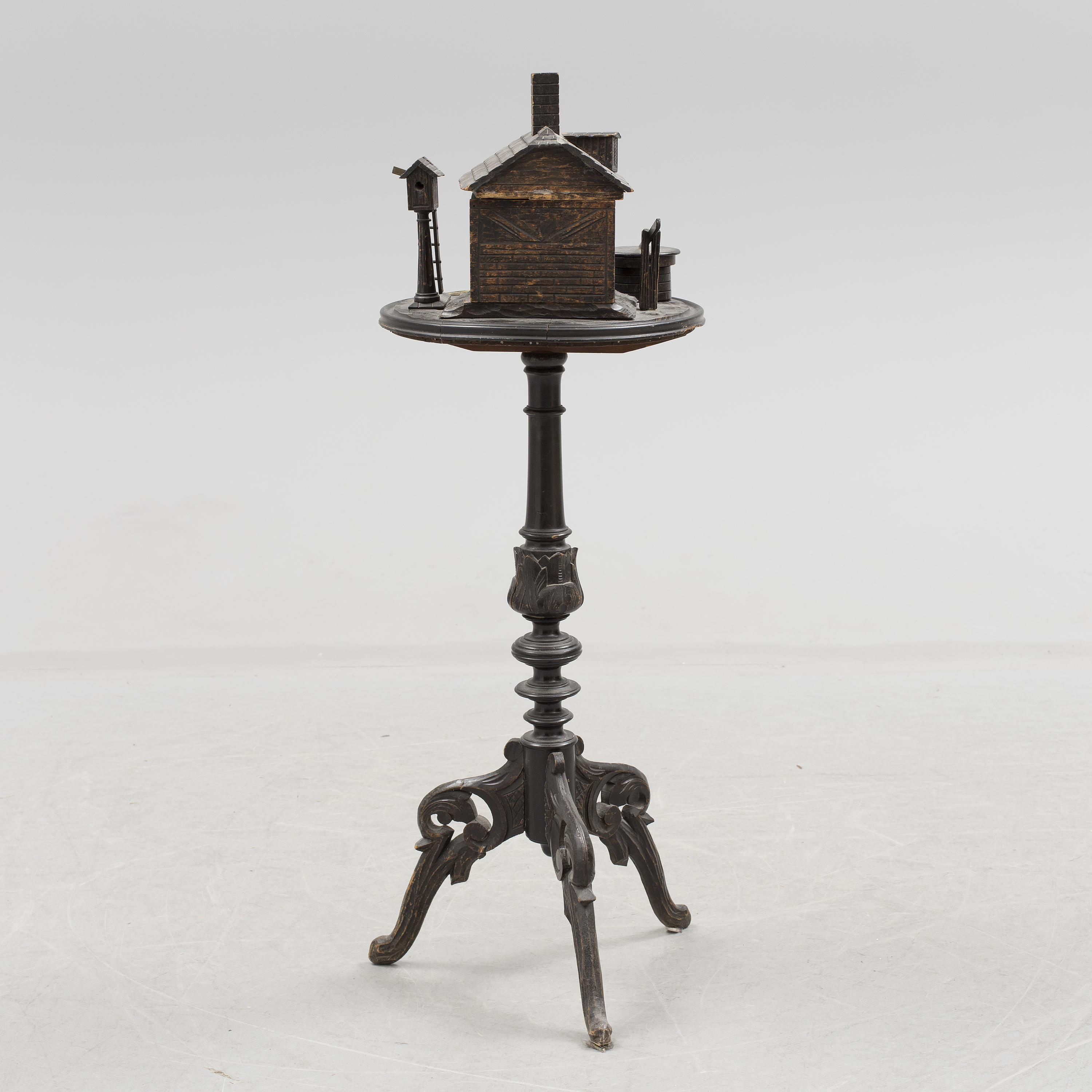 A late 19th century carved smoking table. - Bukowskis