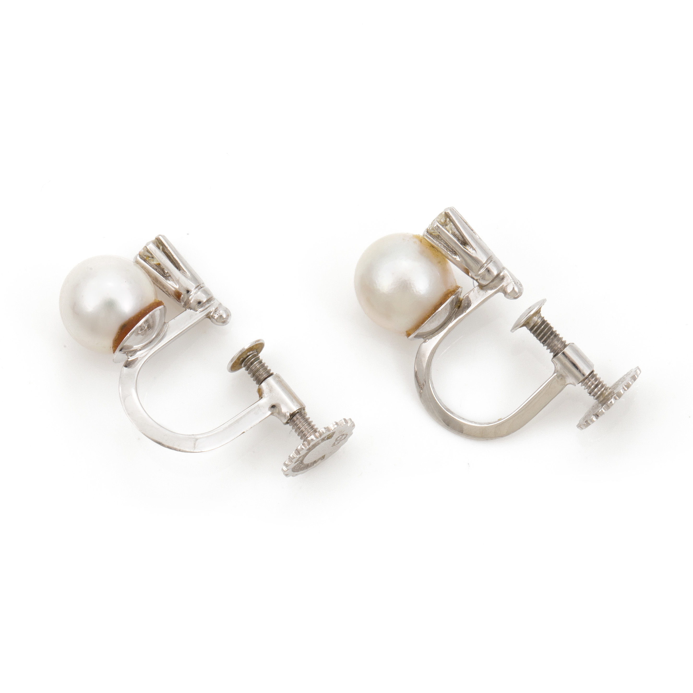 A pair of earrings set with cultured pearls and round, brilliant-cut ...