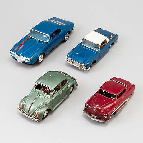 A lot of four tinplate toy cars by Bandai and Marusan, Japan, 1950/60s ...