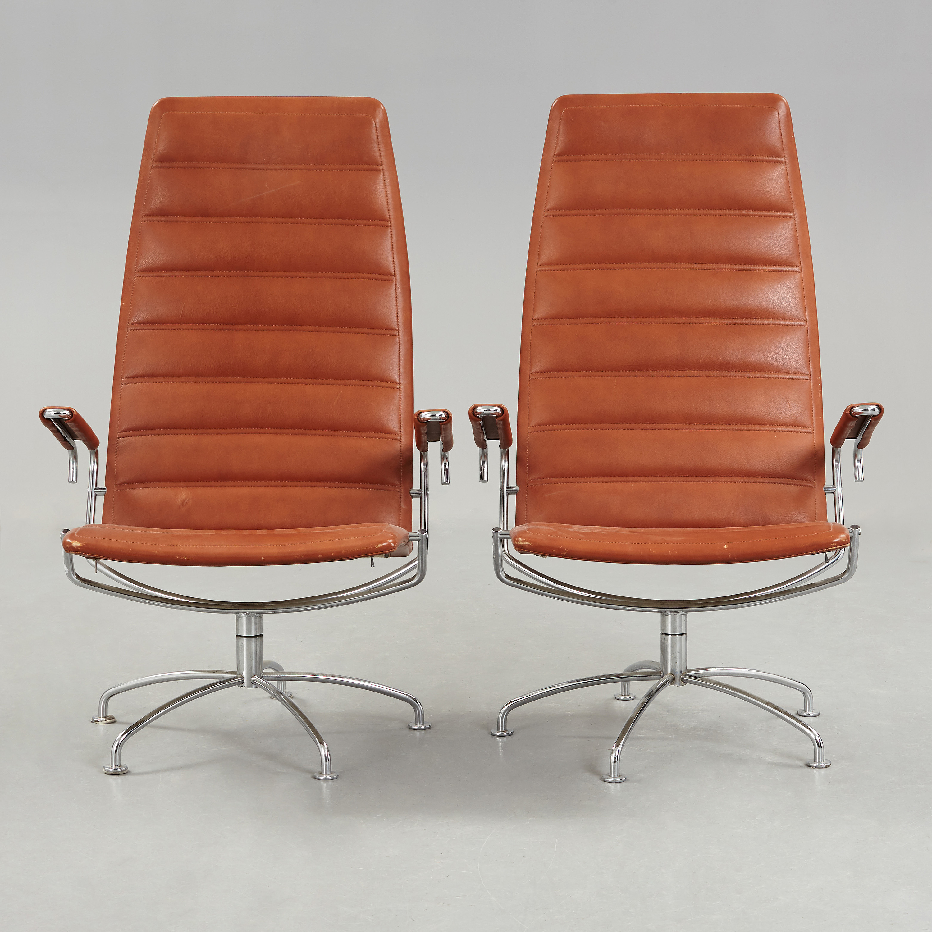 A pair of Jens Amundsen lounge chairs and a side table 'SAS Chair ...