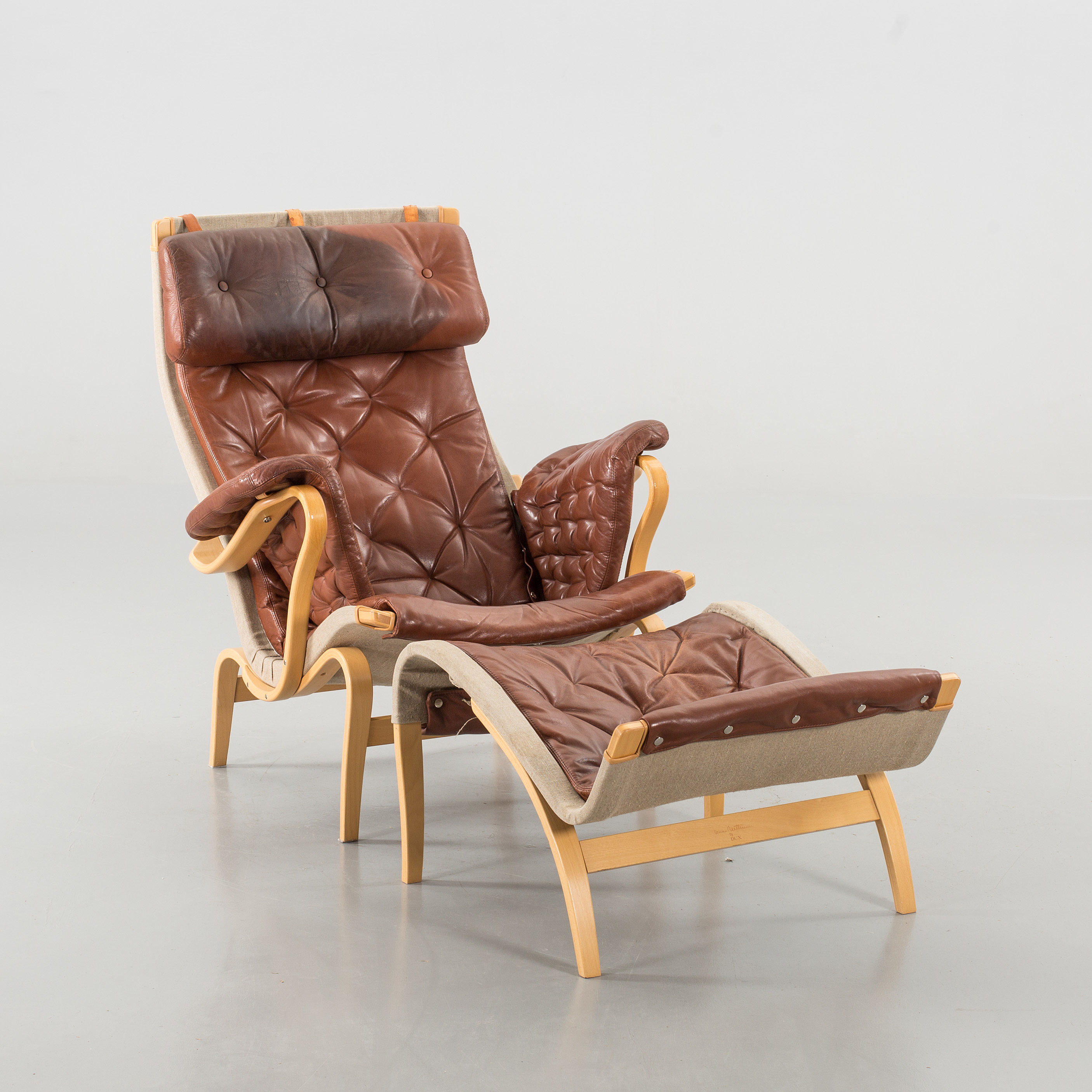 BRUNO MATHSSON, armchair and stool. - Bukowskis