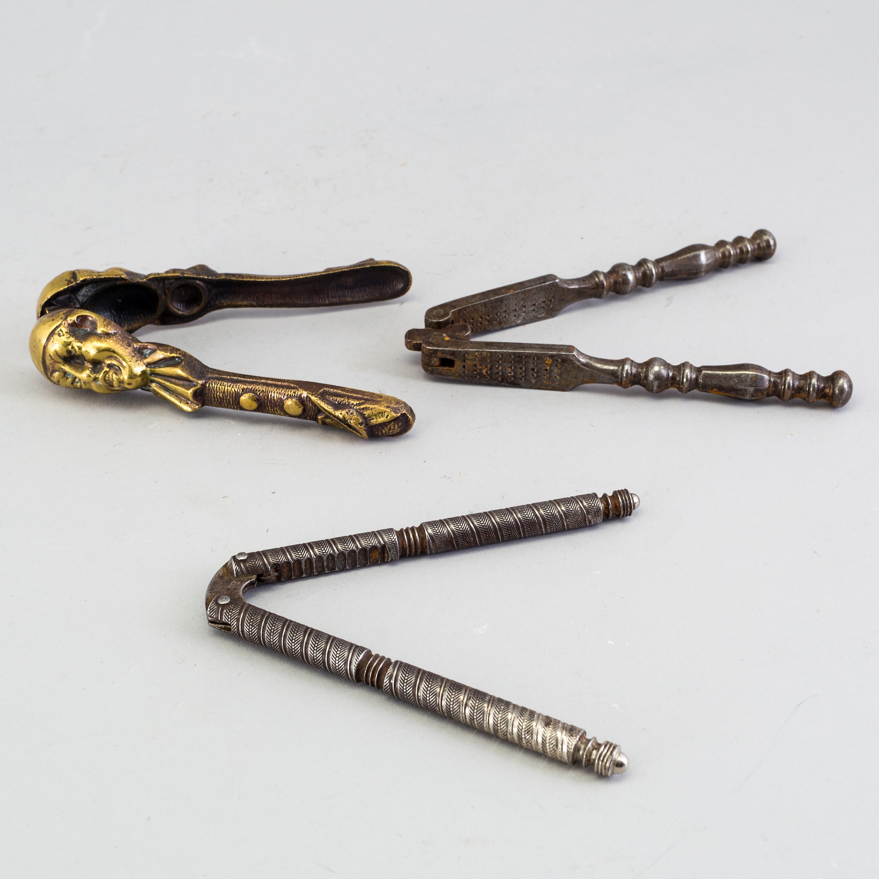 THREE BRONZE AND CAST IRON NUT CRACKERS, 18th/19th century. - Bukowskis