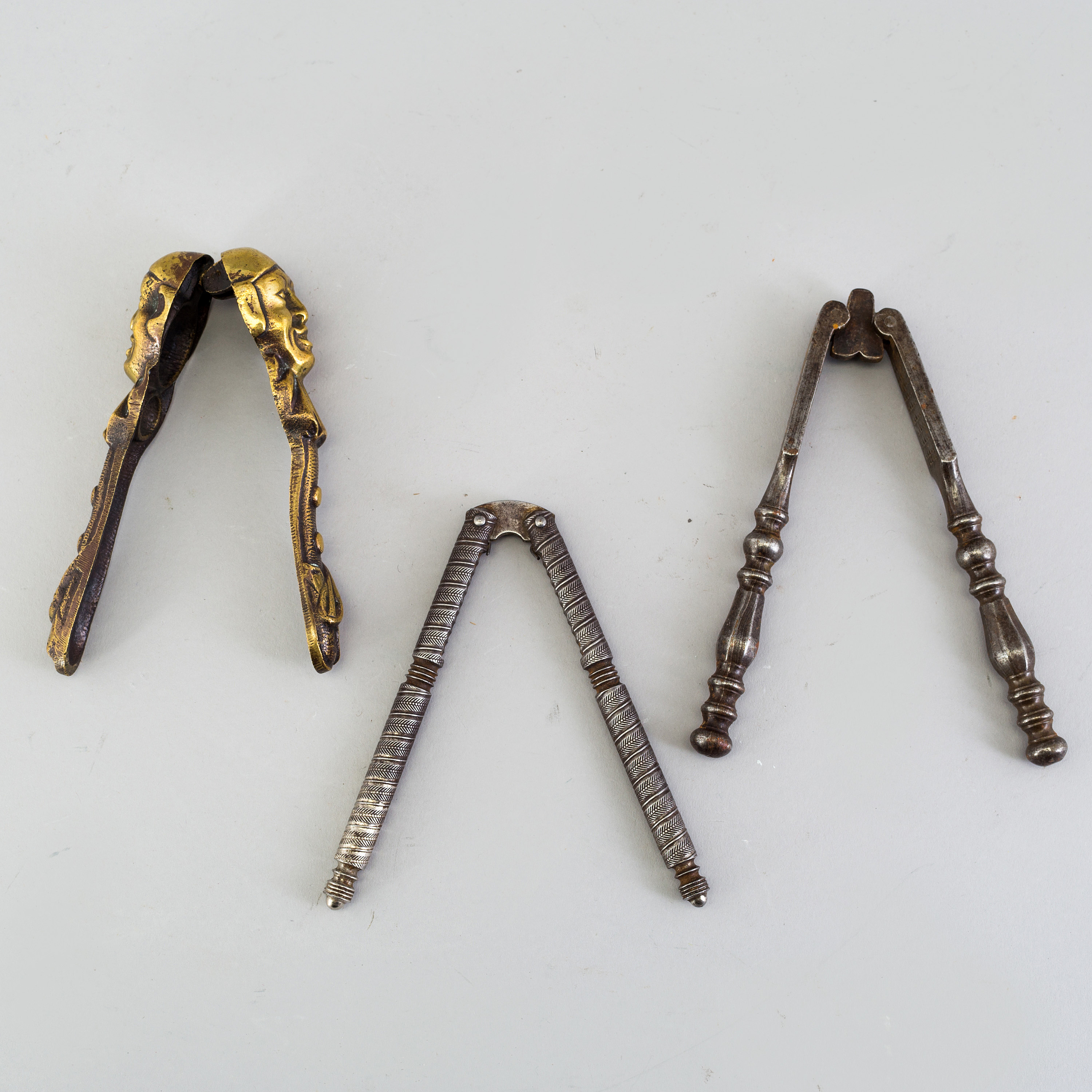 THREE BRONZE AND CAST IRON NUT CRACKERS, 18th/19th century. - Bukowskis