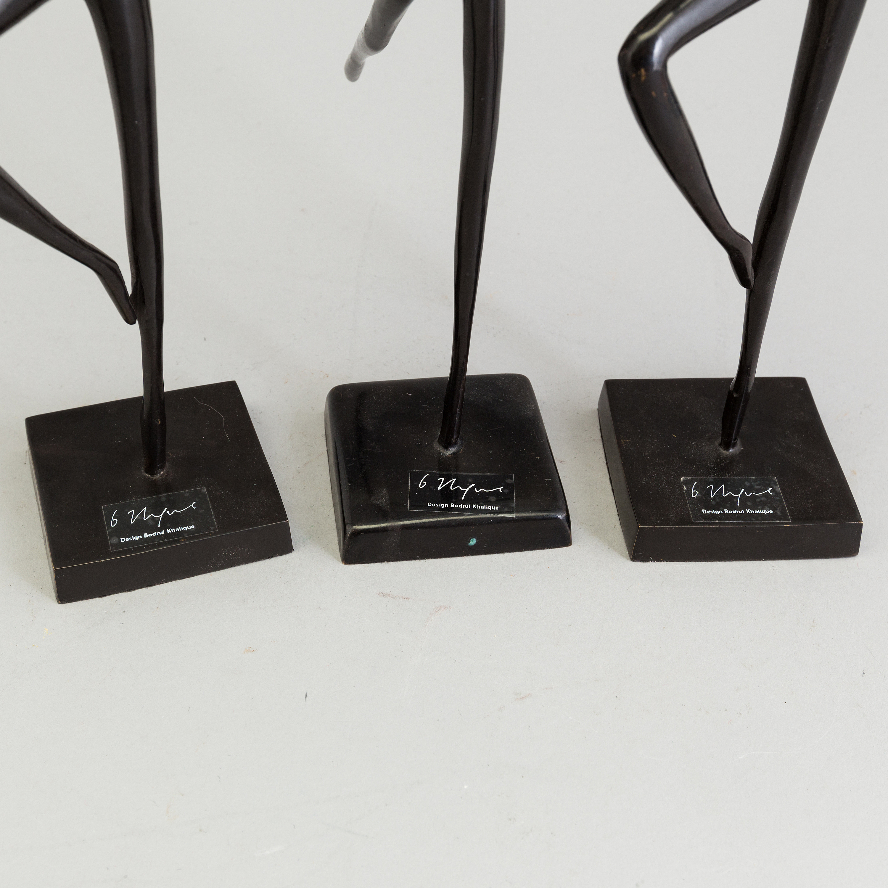 Three bronze figures design Bodrul Khalique. - Bukowskis