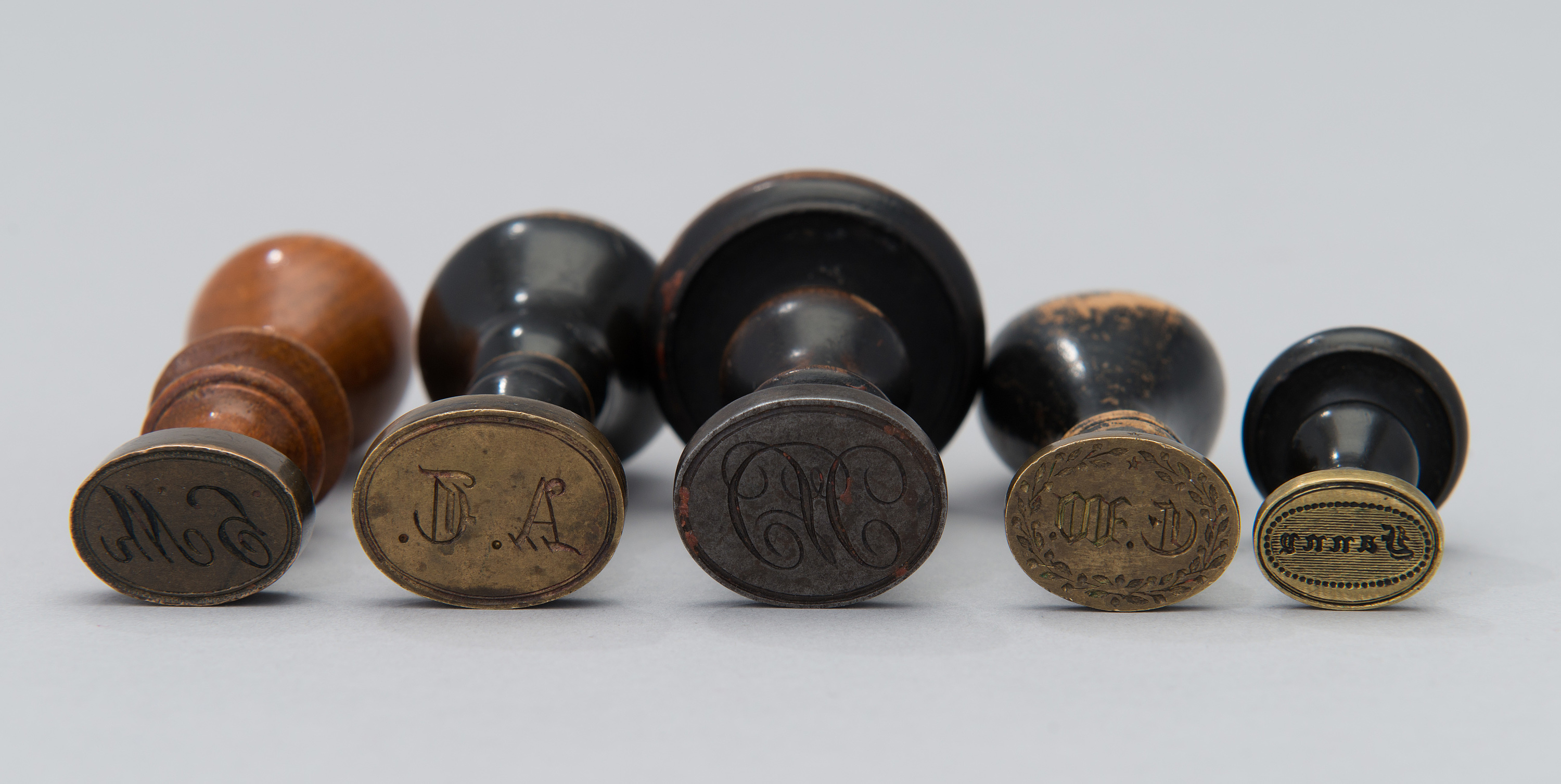 Five seals in brass and wood from the latter half of the 19th century ...