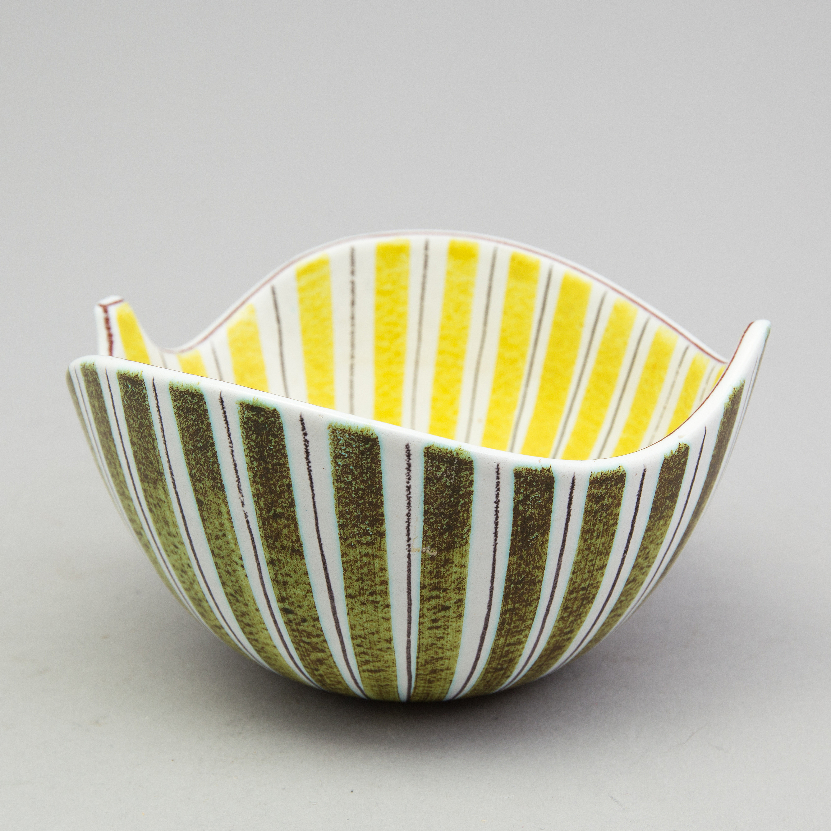 A stoneware bowl designed by Stig Lindberg, signed and numbered for ...